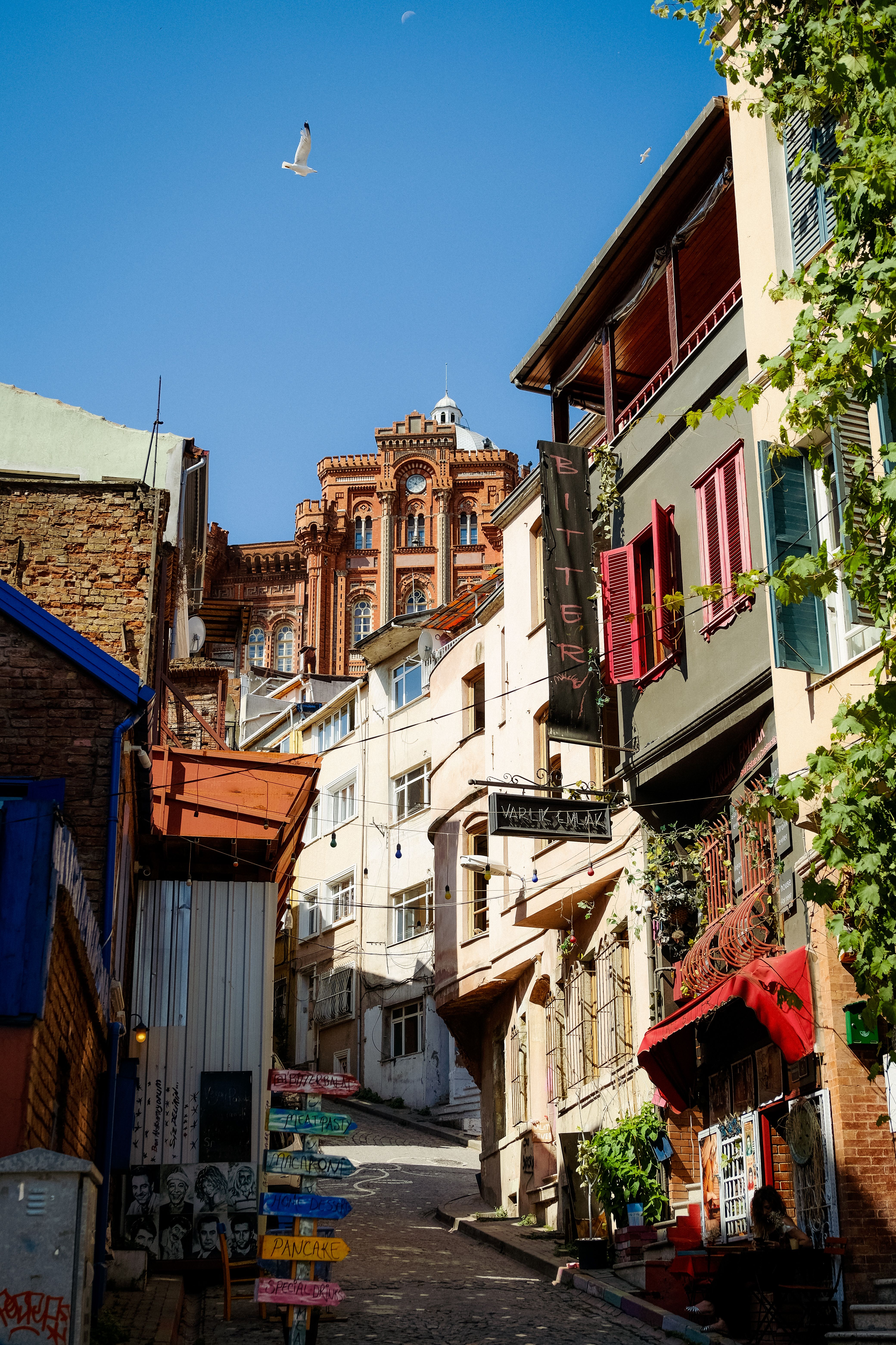 Low-Angle Shot Alleyway between Concrete Buildings · Free Stock Photo