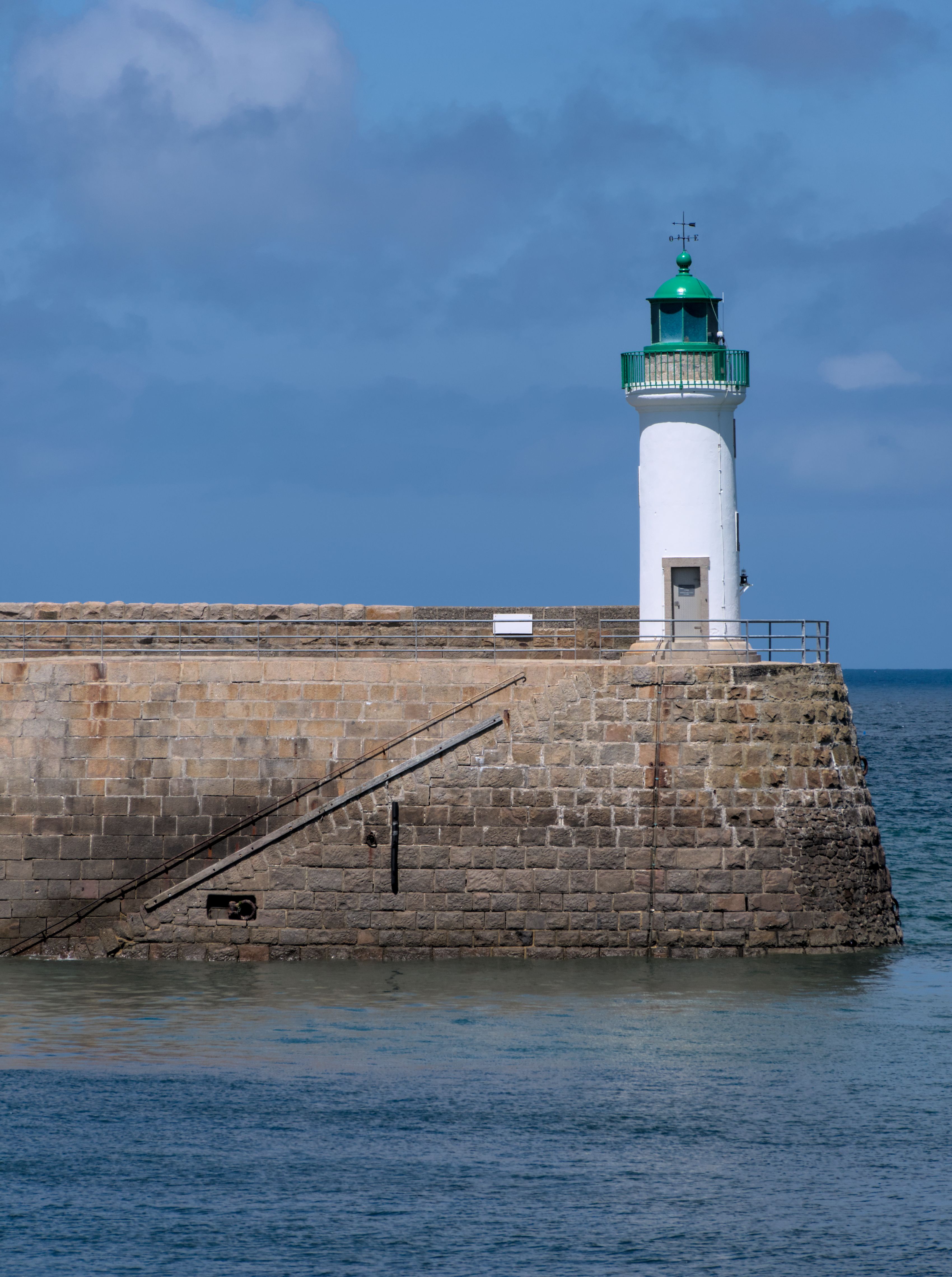 Lighthouse on the Brick Structure and Sea · Free Stock Photo