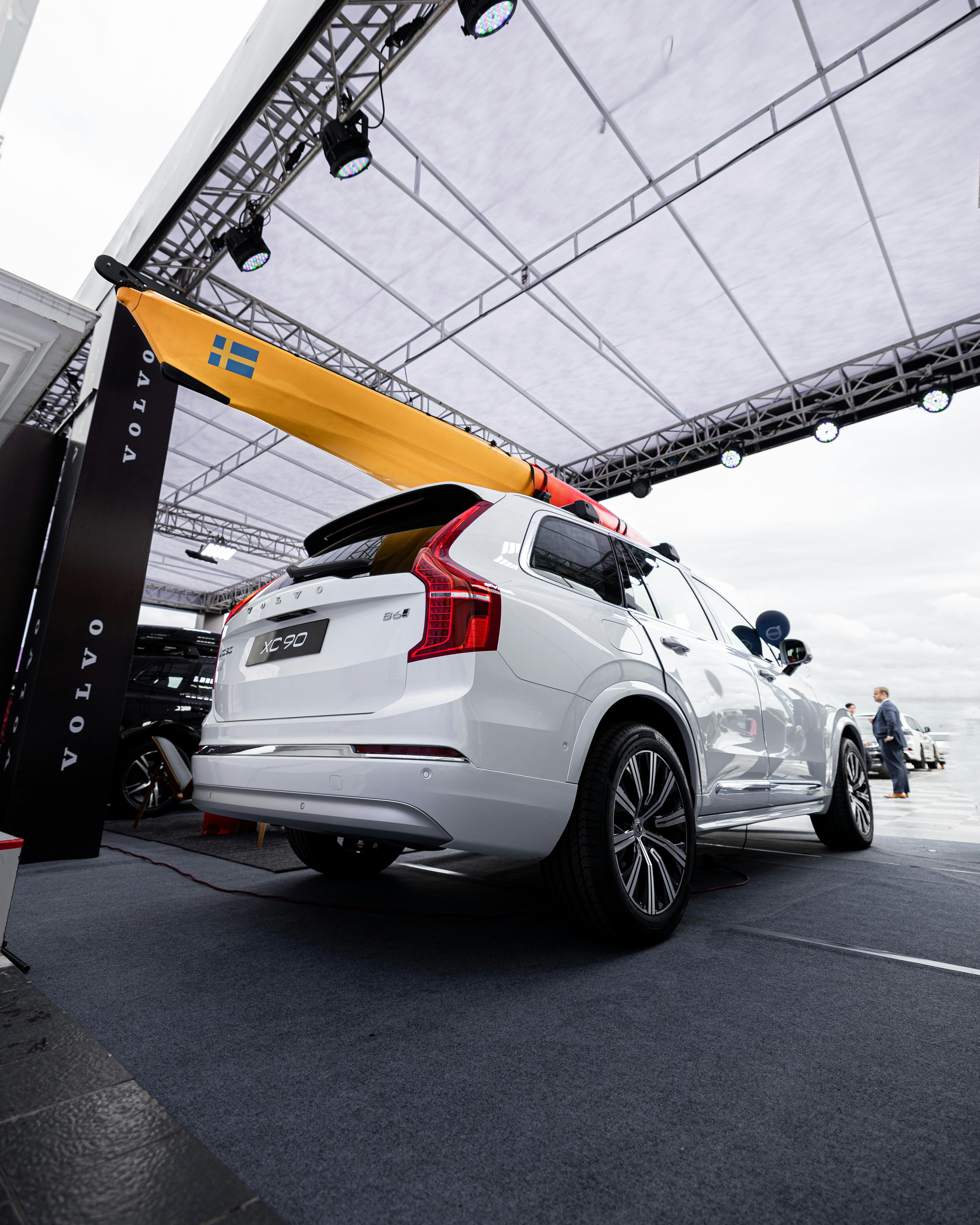 Low Angle Shot of a White Volvo XC90 at a Car Exhibition · Free Stock Photo