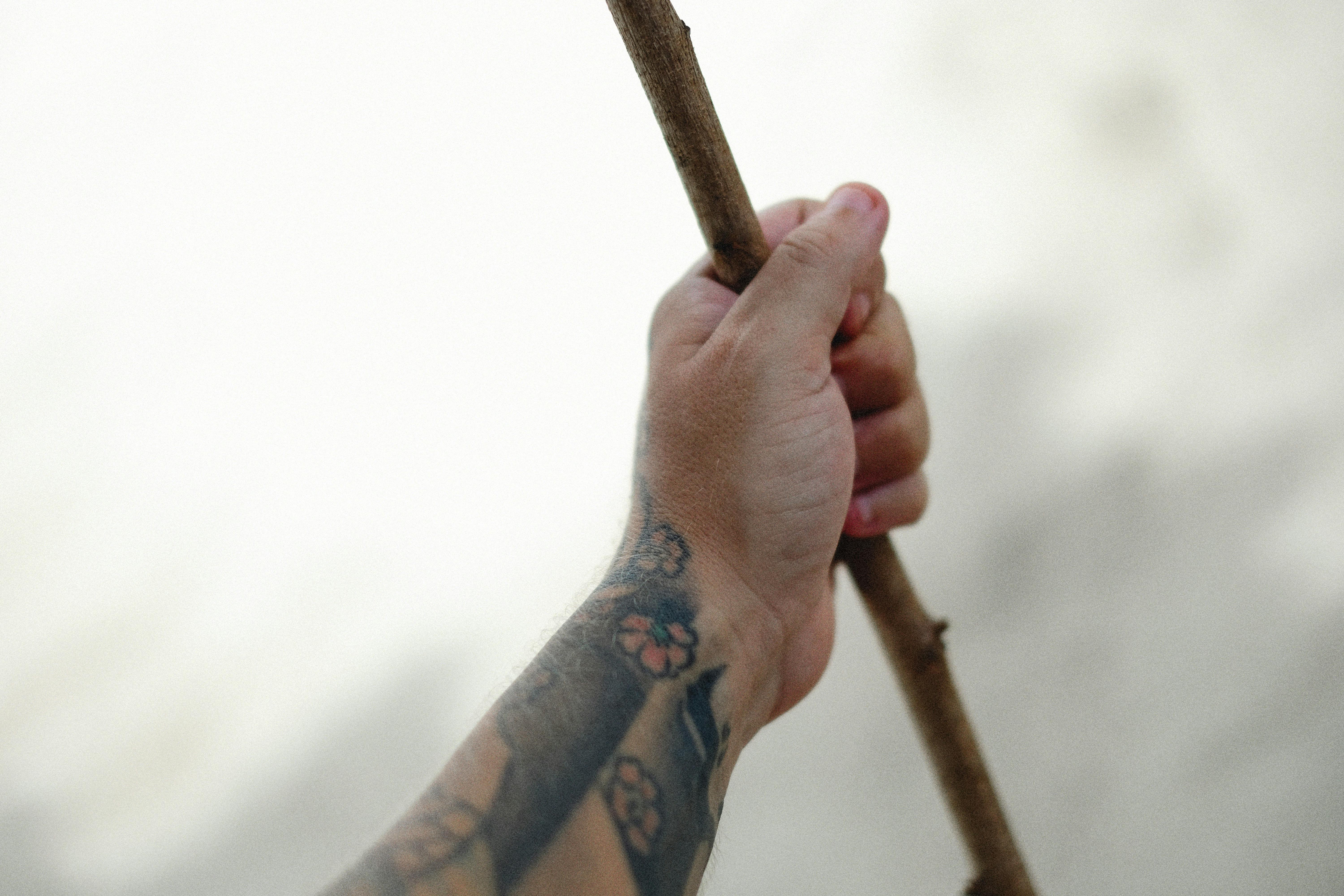 A Person Holding a Stick · Free Stock Photo