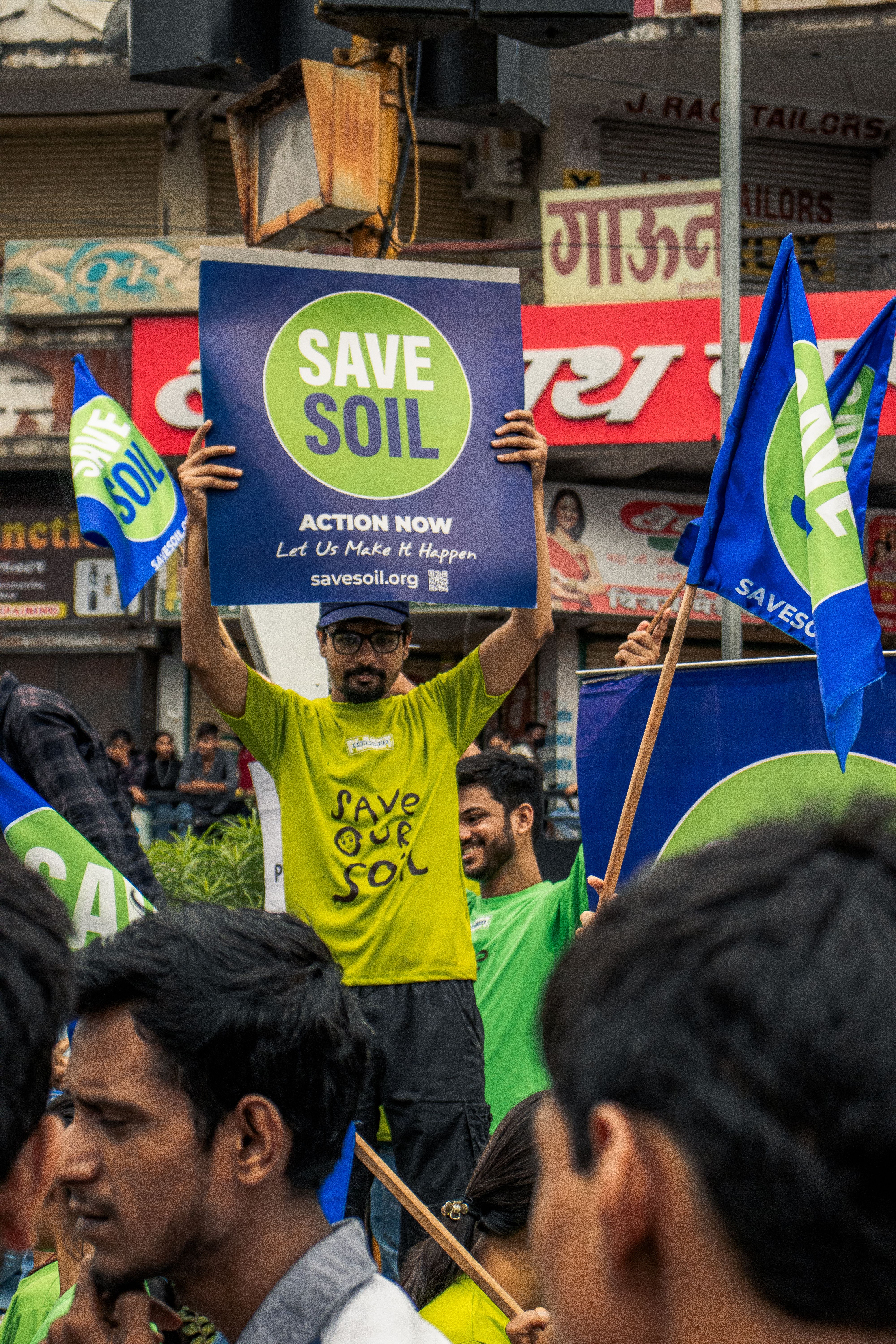 Man Holding Placard during Manifestation · Free Stock Photo