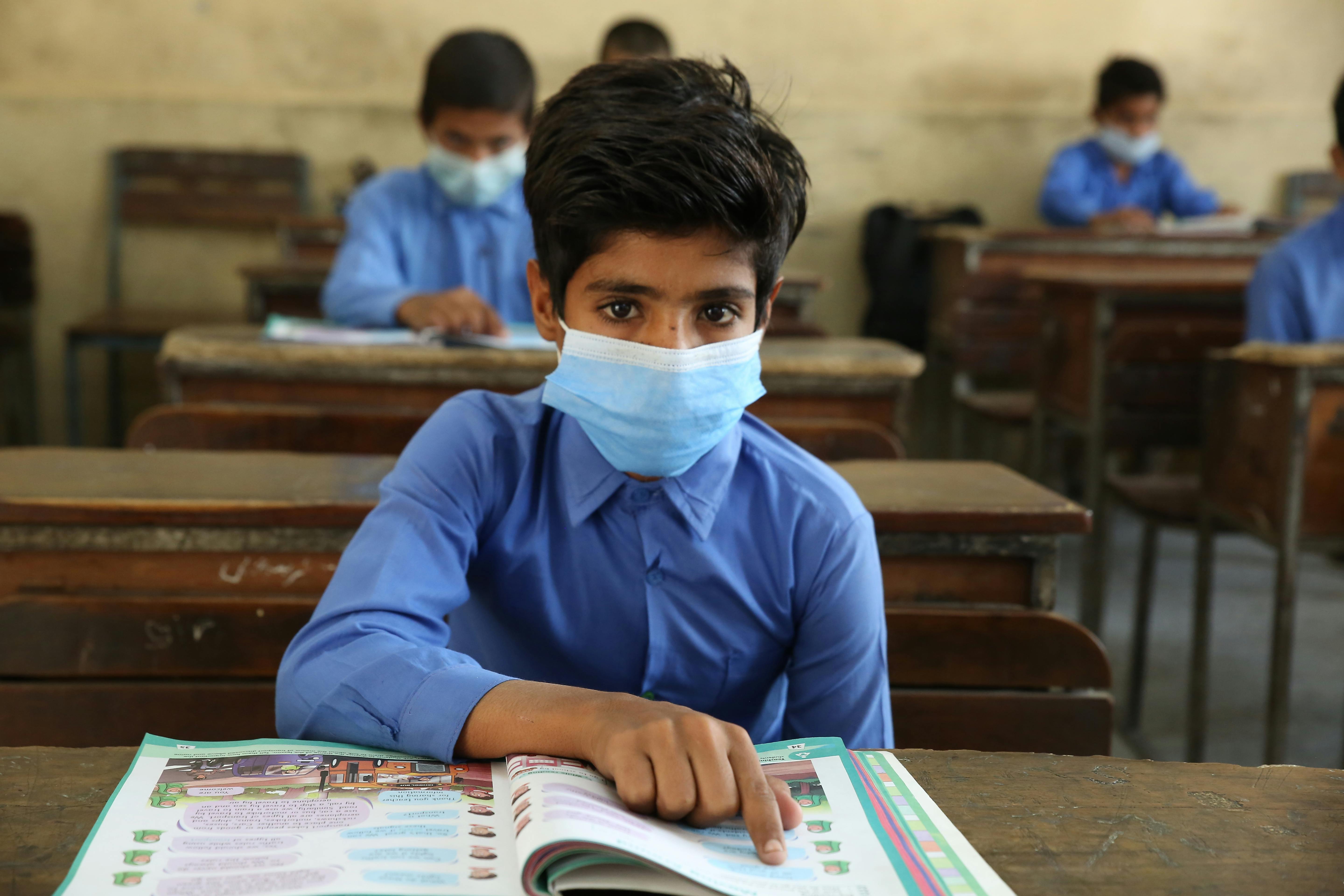 Boy Wearing a Face Mask at School · Free Stock Photo