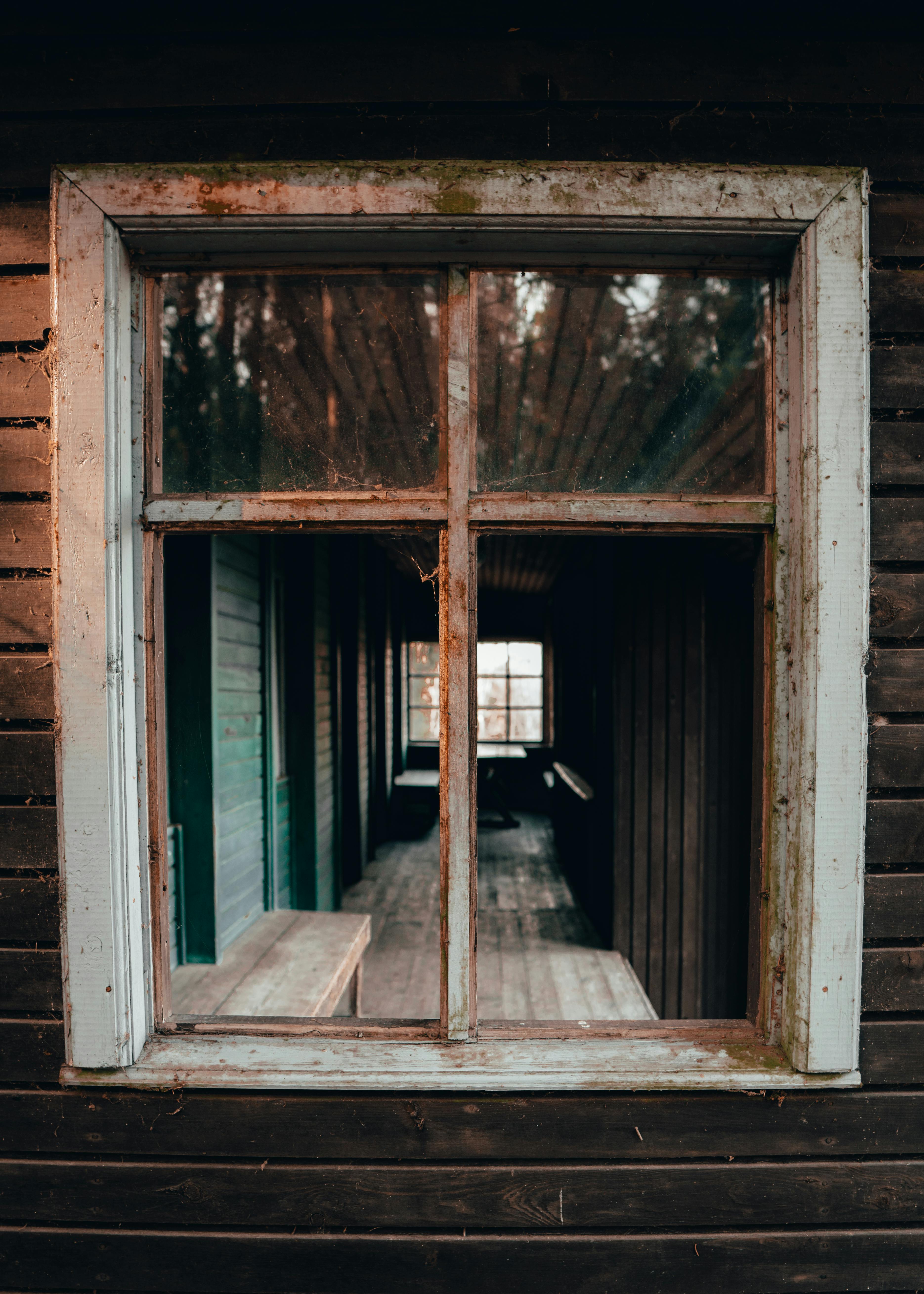 A Rotten Wooden Window of an Abandoned House · Free Stock Photo