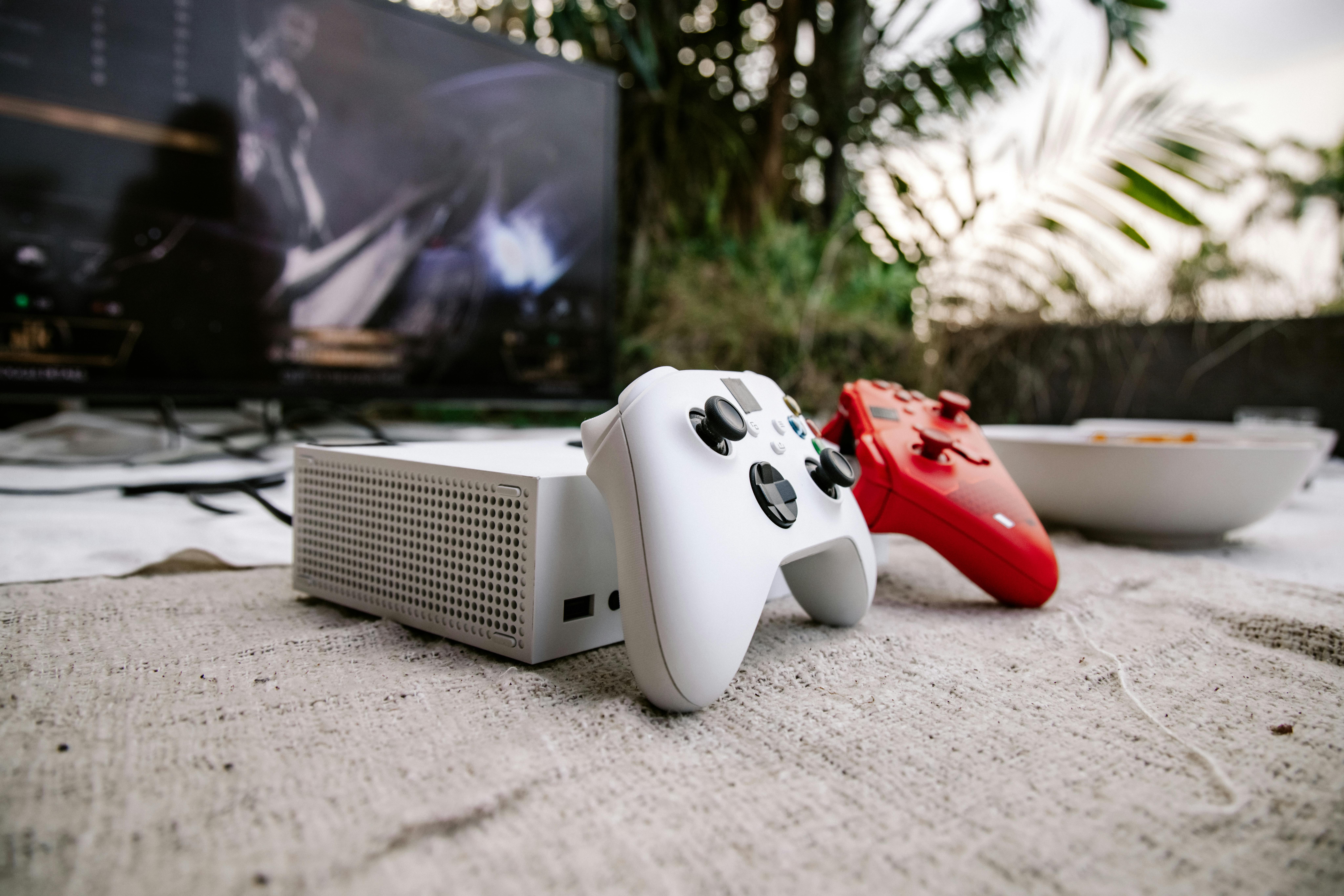 Game Controllers and a Game Console · Free Stock Photo
