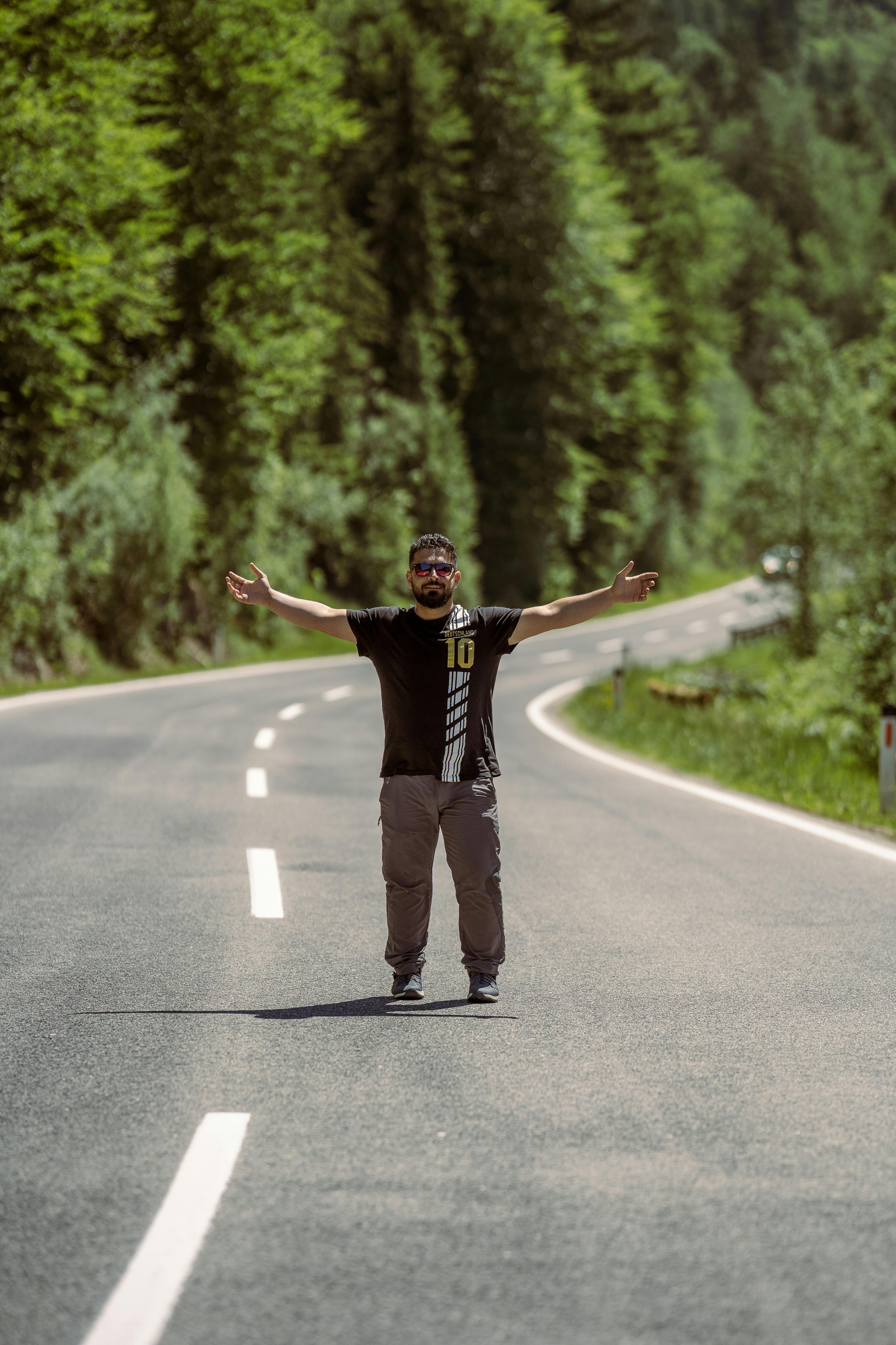 A Man Standing on a Road · Free Stock Photo