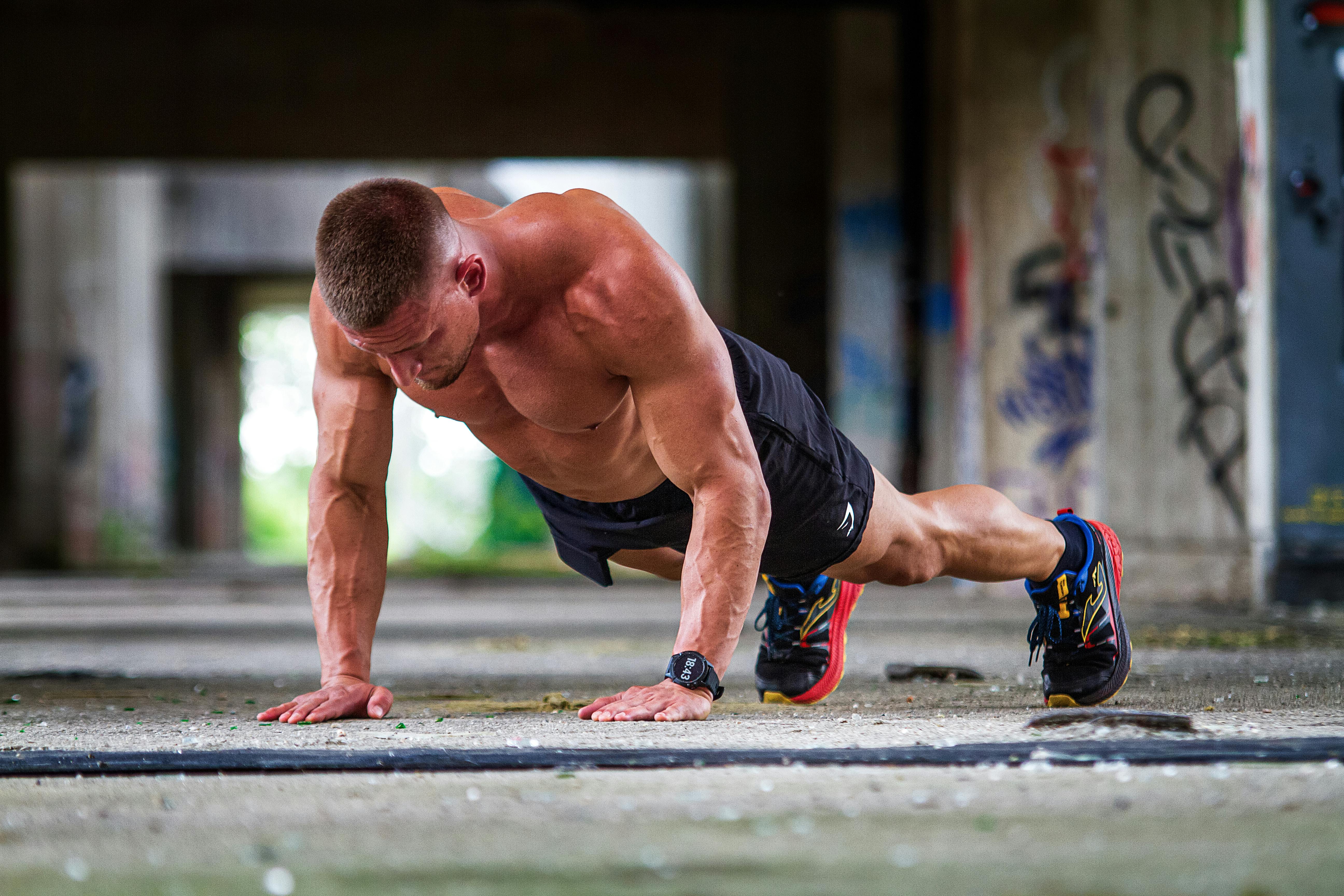 Shirtless Muscular Man Doing Push-ups · Free Stock Photo