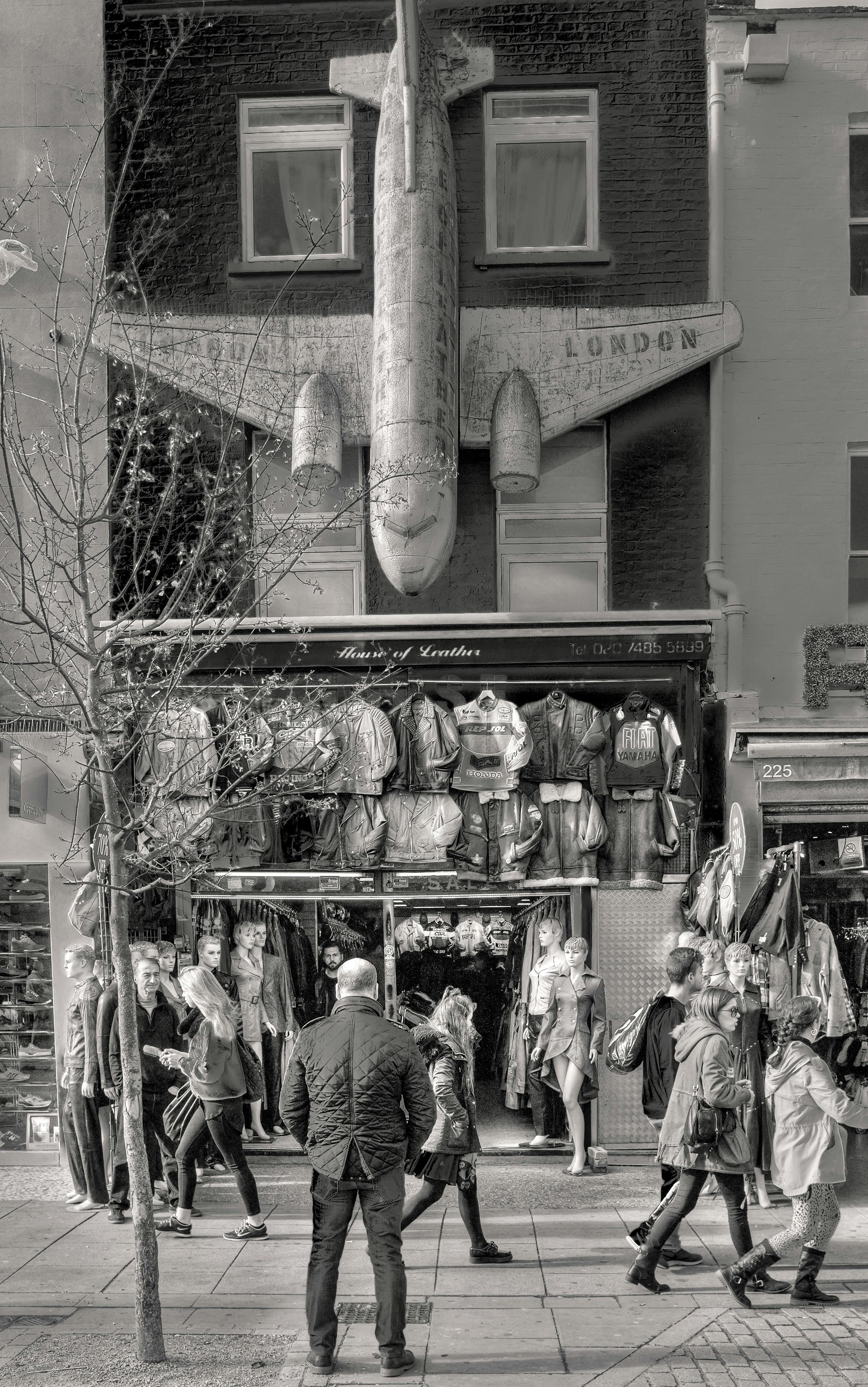 People Passing in Front of a Store · Free Stock Photo