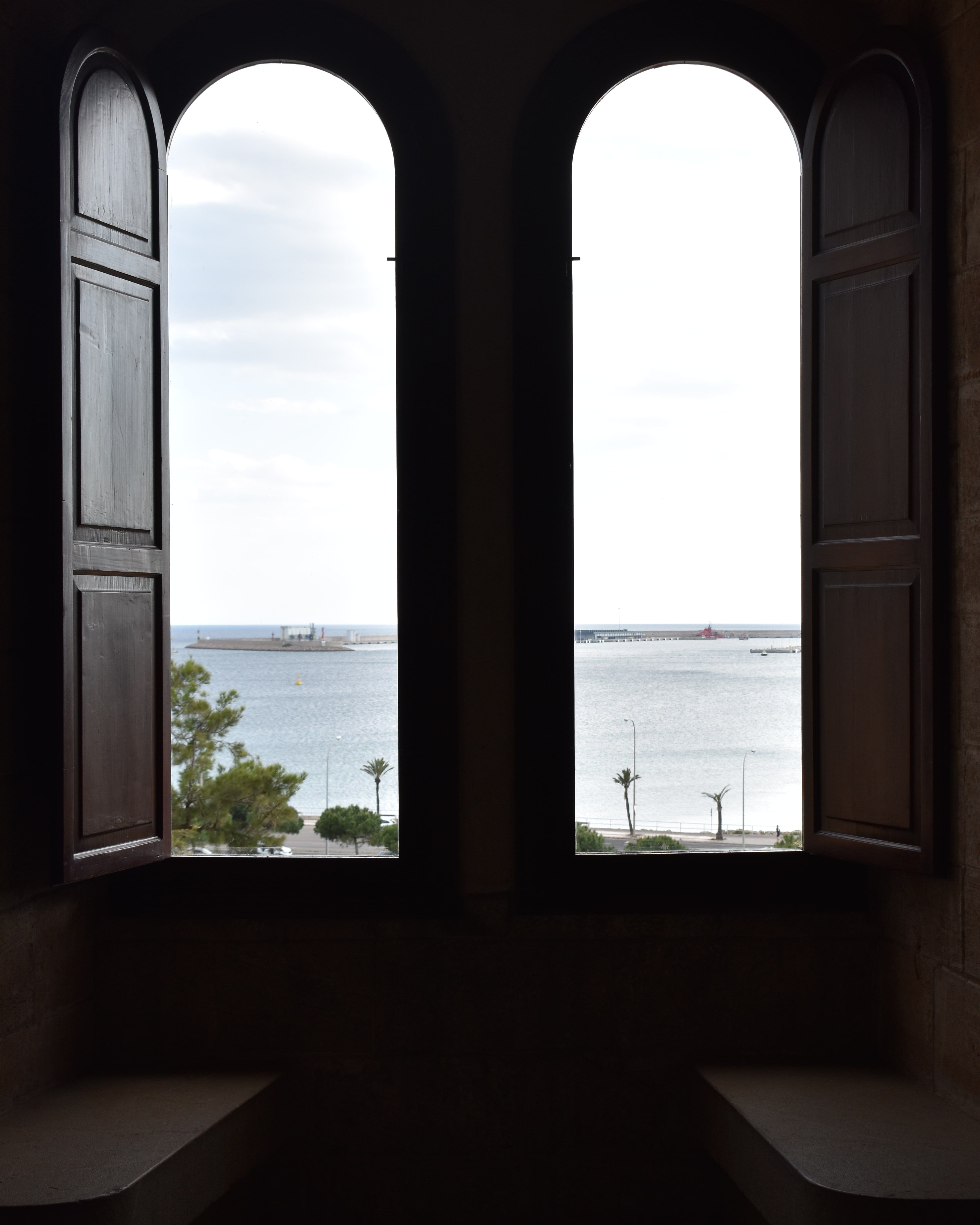 Photo of a Sea Seen through Opened Windows · Free Stock Photo