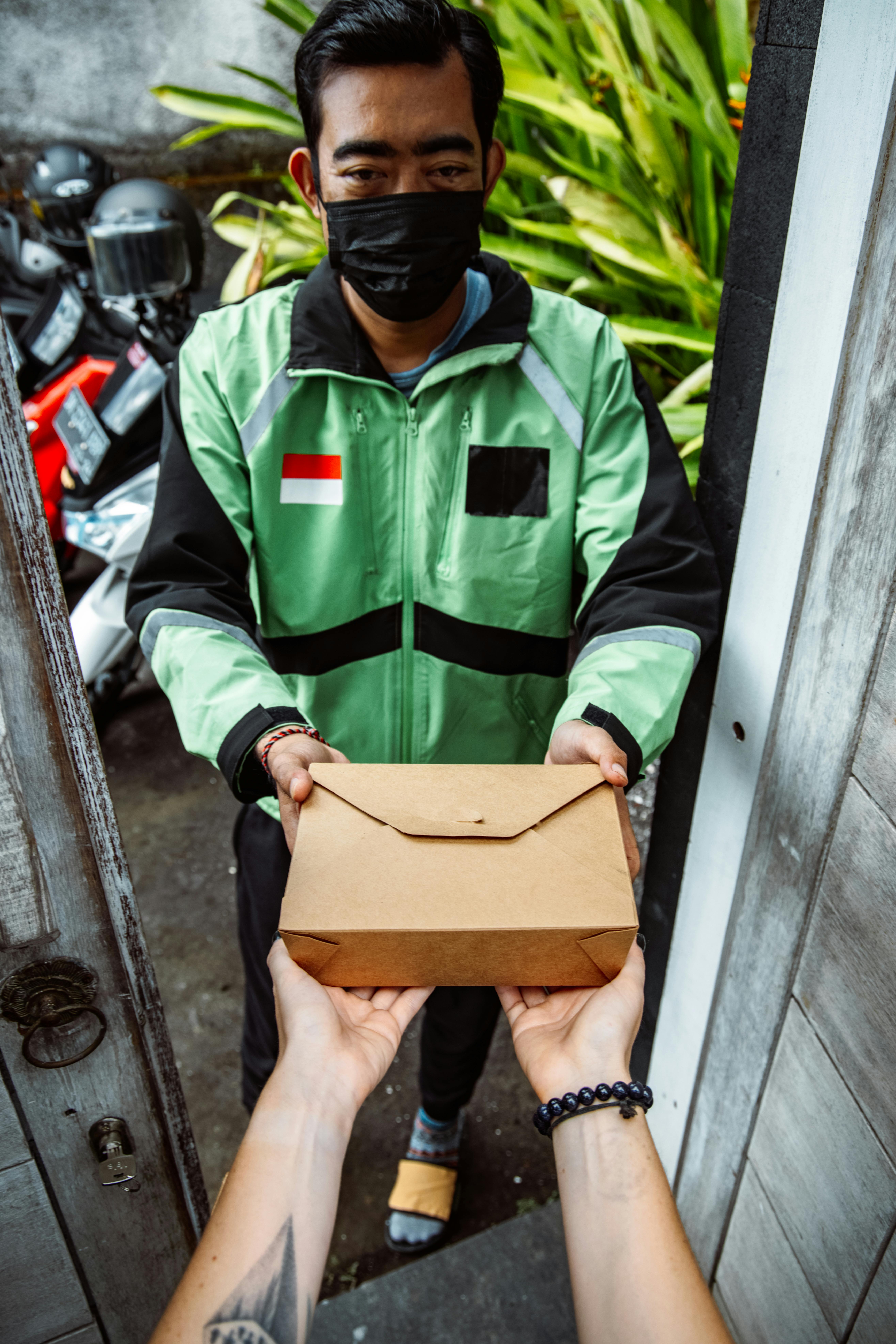 Photo of a Food Delivery in an Home Entrance · Free Stock Photo