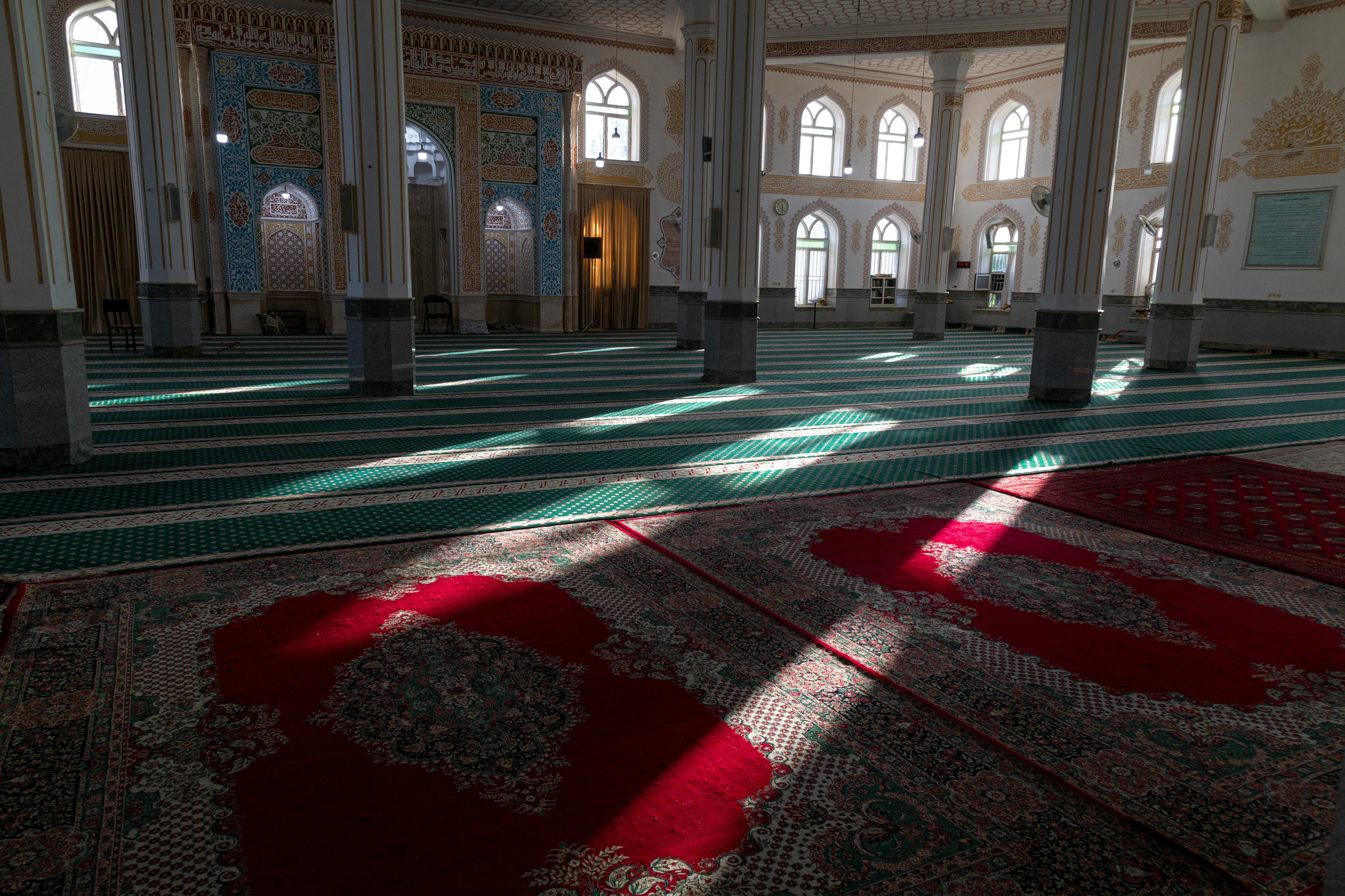 Mosque Interior with Red and Green Carpet · Free Stock Photo