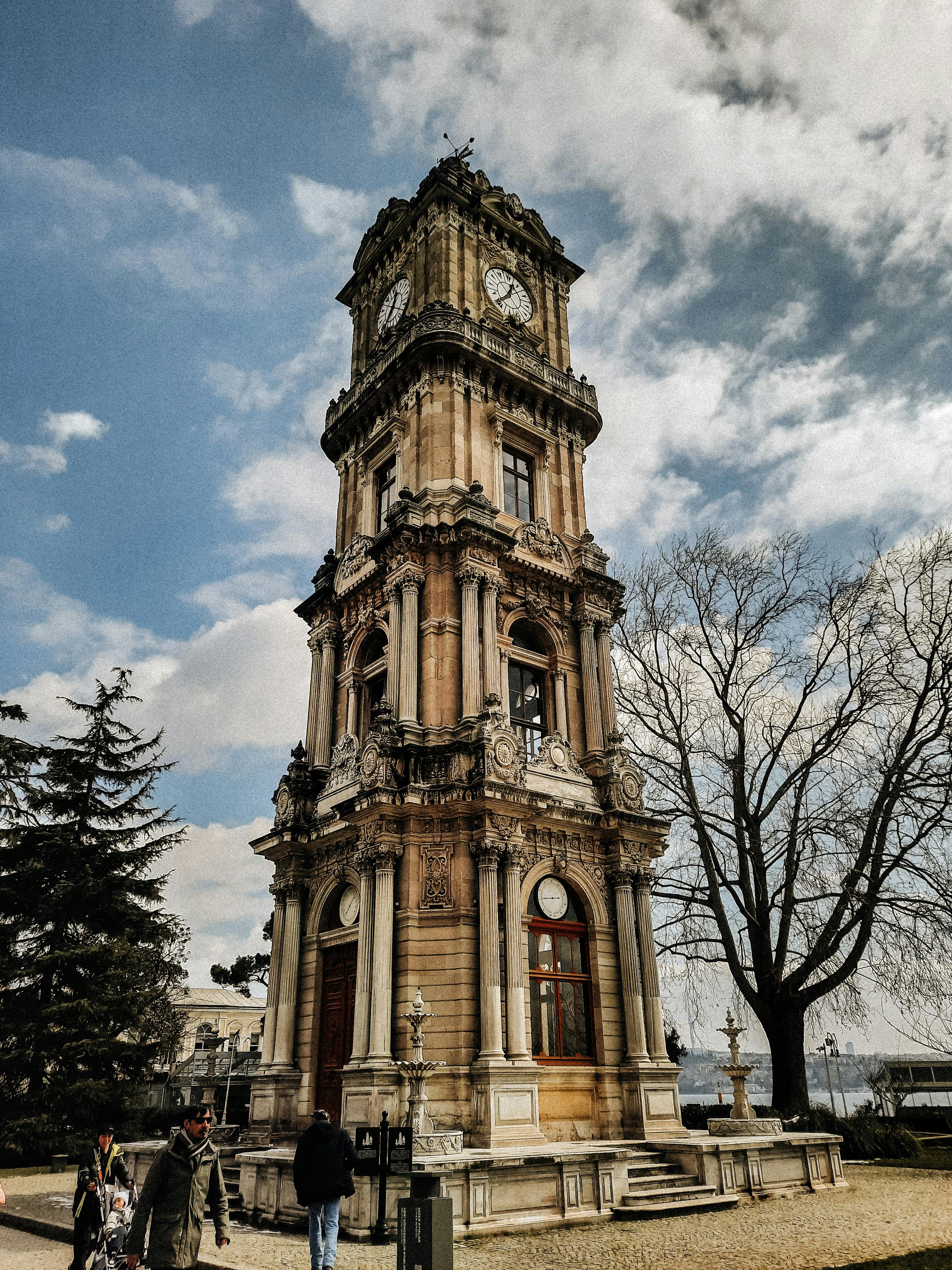 Historic Structure Building with Clock Under White Sky · Free Stock Photo
