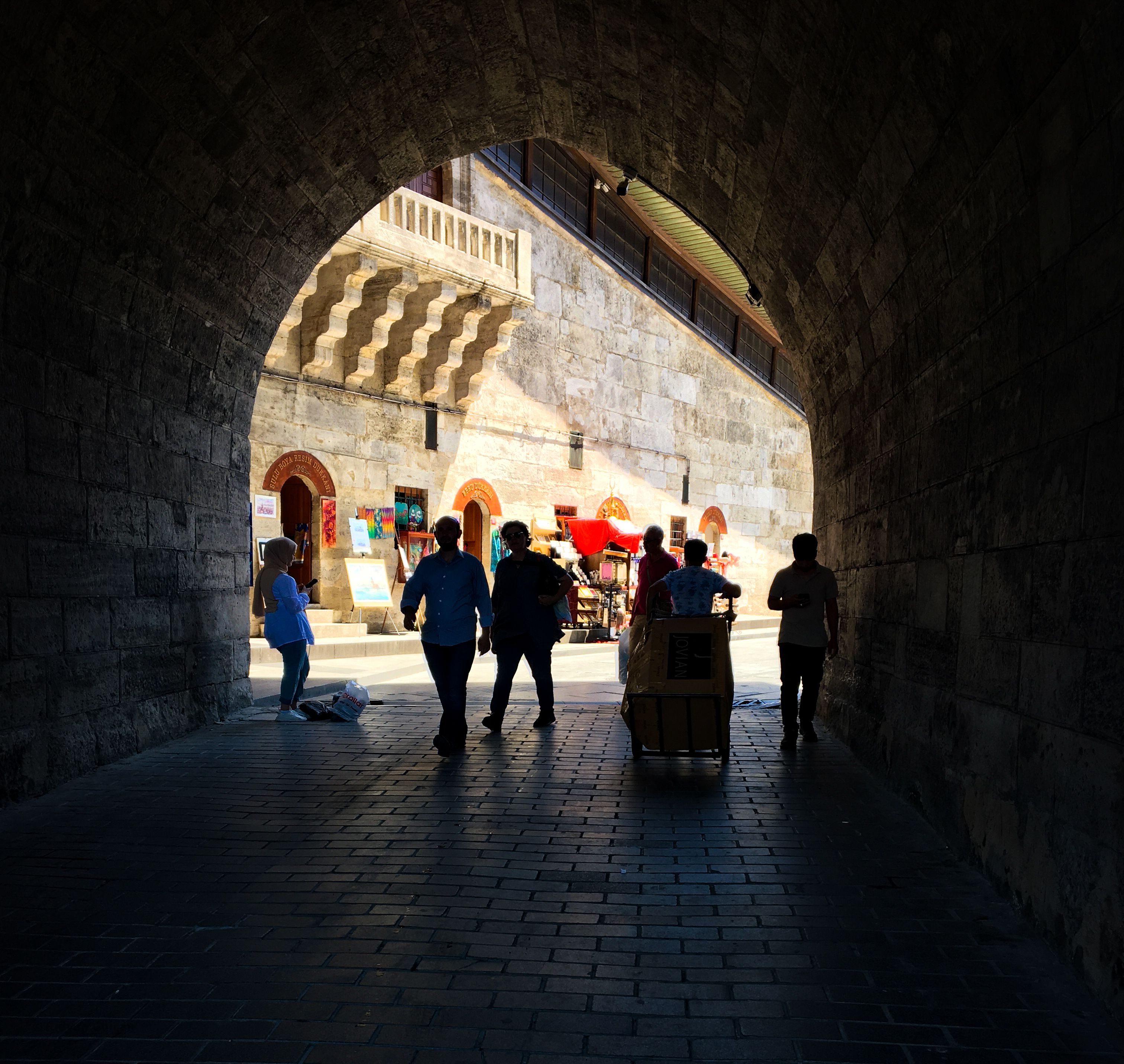 People Standing and Sitting on Outside Hallway of a Building · Free ...