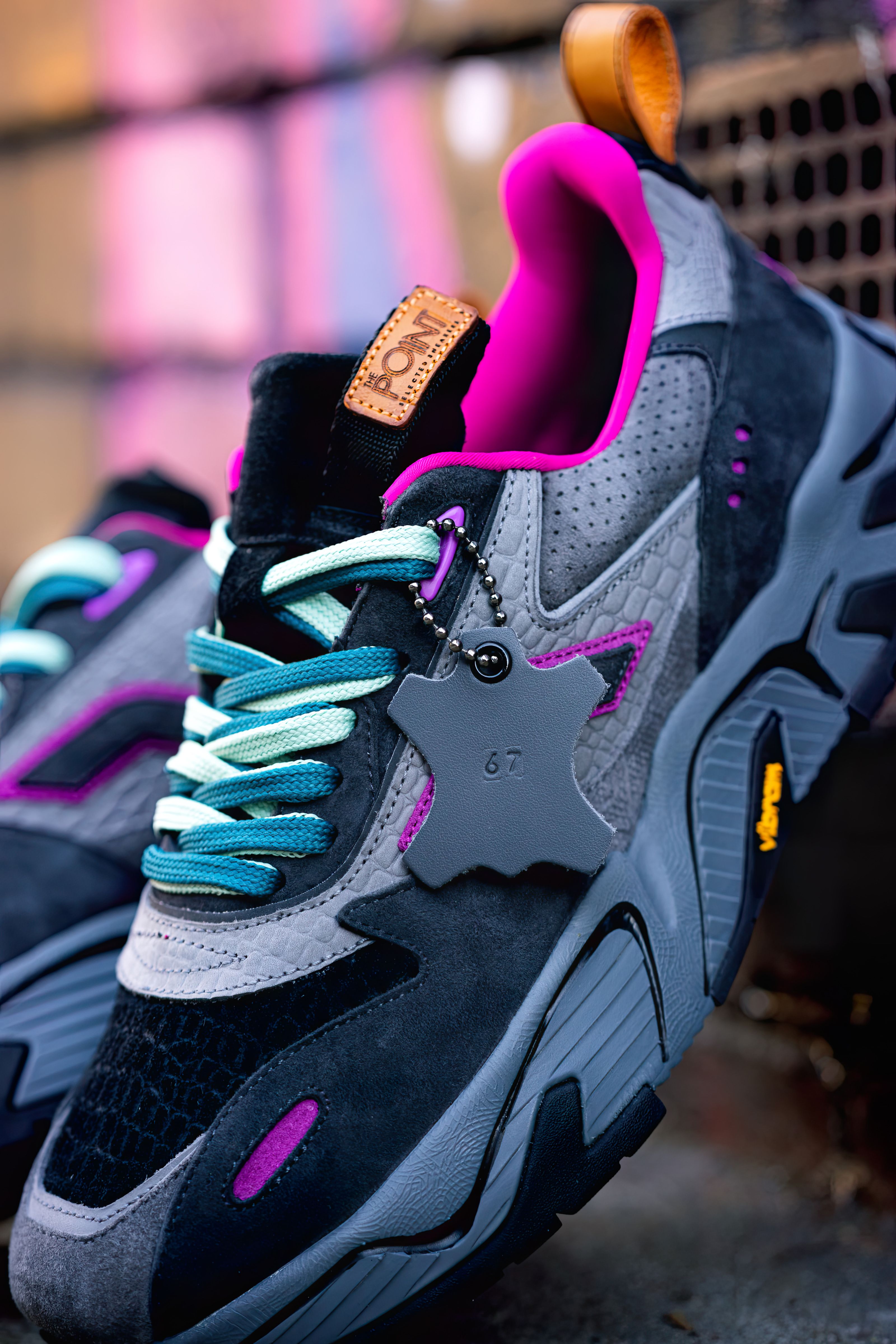 Gray Rubber Shoes With White and Blue Laces on Display · Free Stock Photo