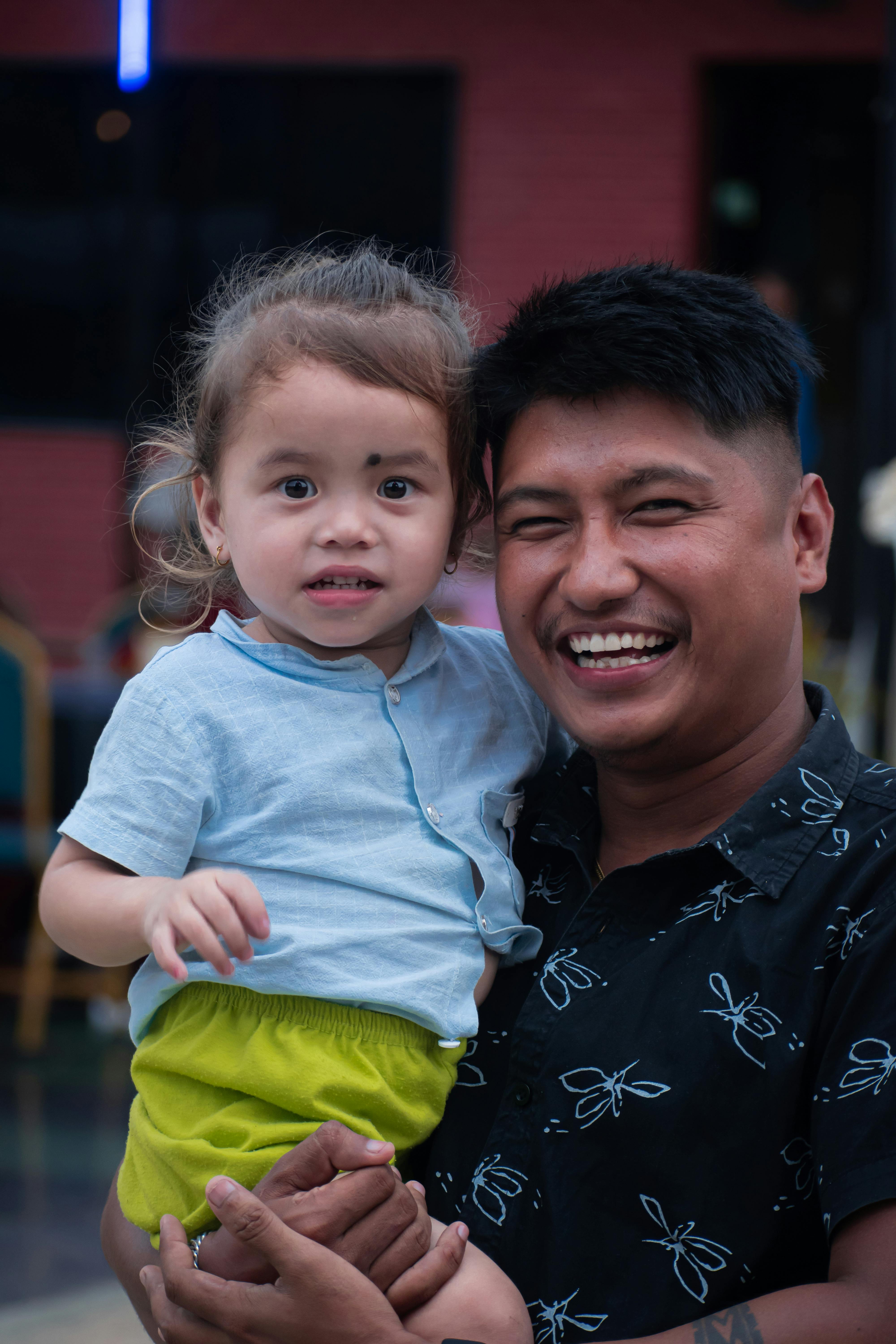 Child in Father Arms · Free Stock Photo