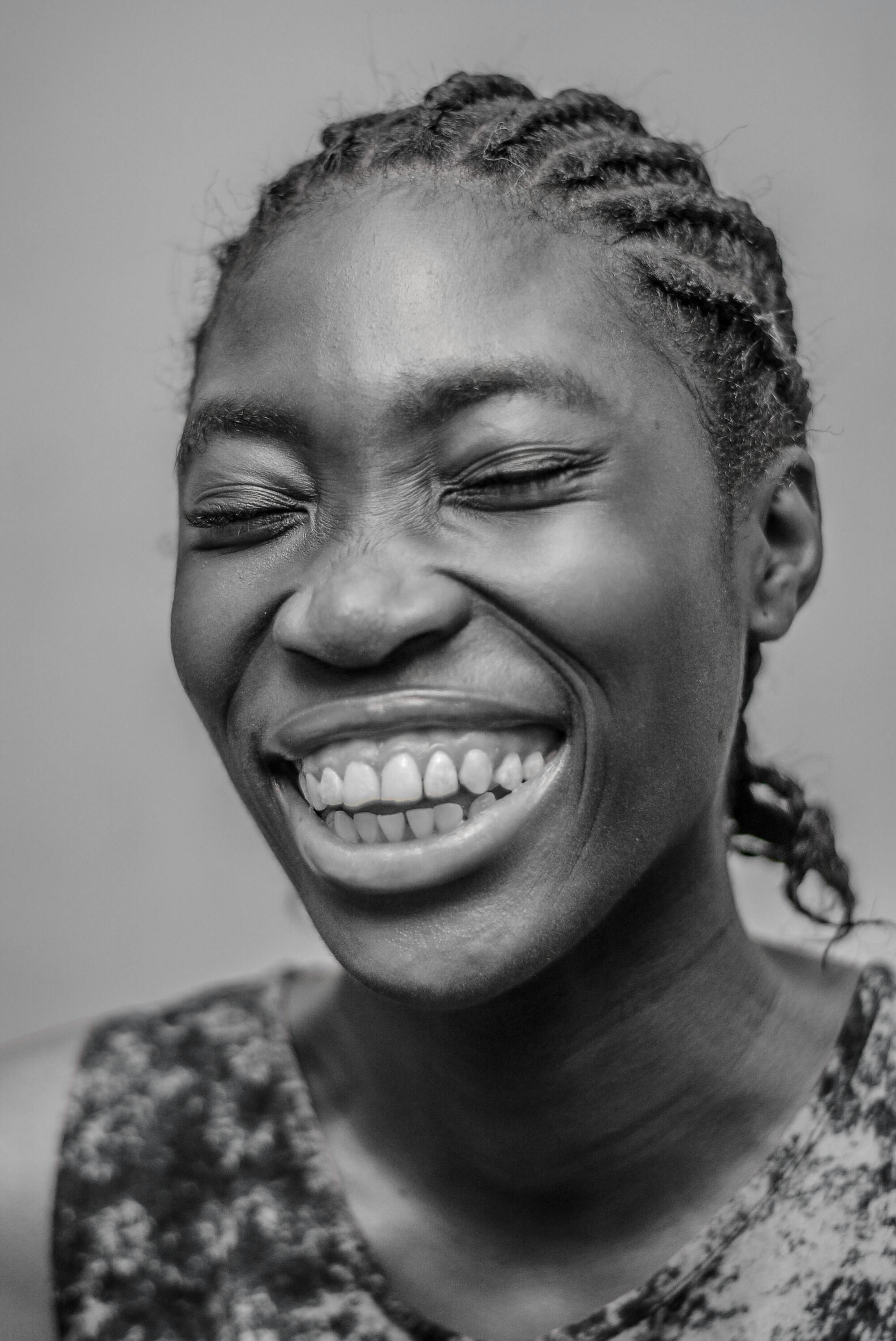 Grayscale Portrait of a Happy Woman · Free Stock Photo