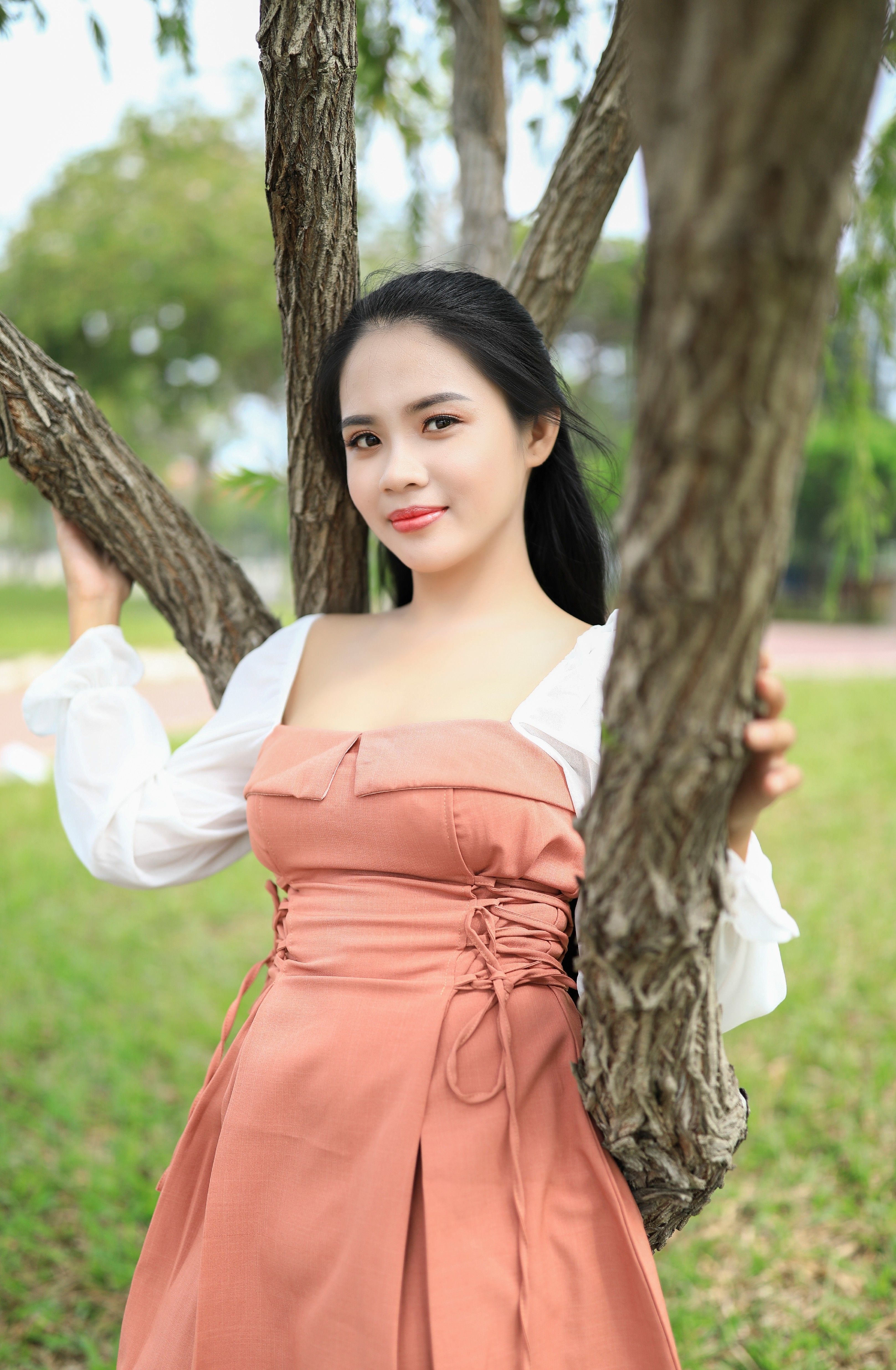 Girl in Dress Posing near Tree · Free Stock Photo