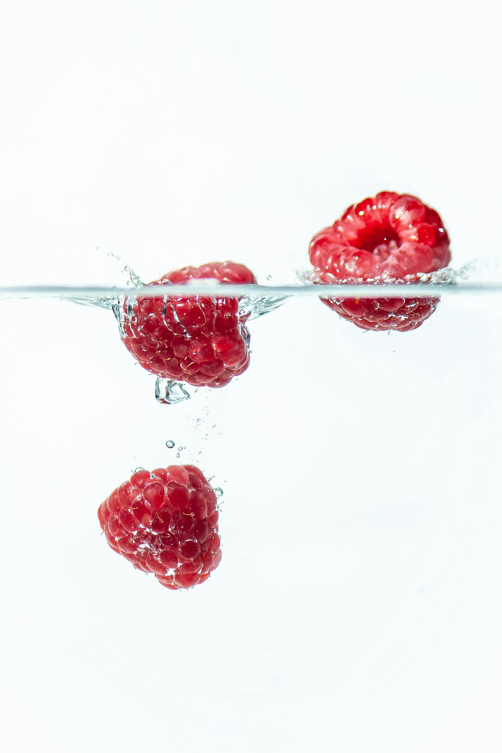 Raspberries Falling Into the Water · Free Stock Photo