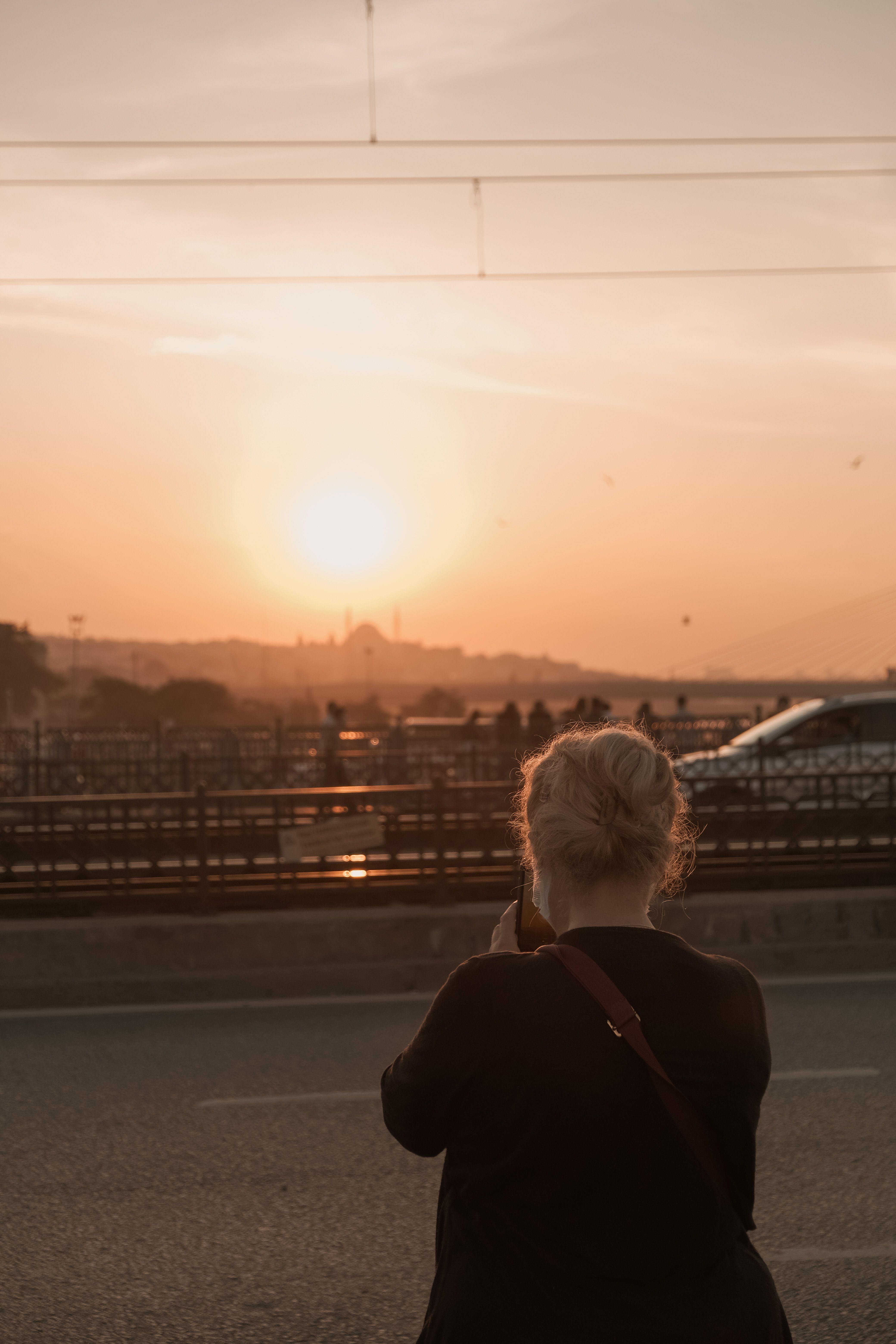 Back View of a Person Standing by the Roadside · Free Stock Photo