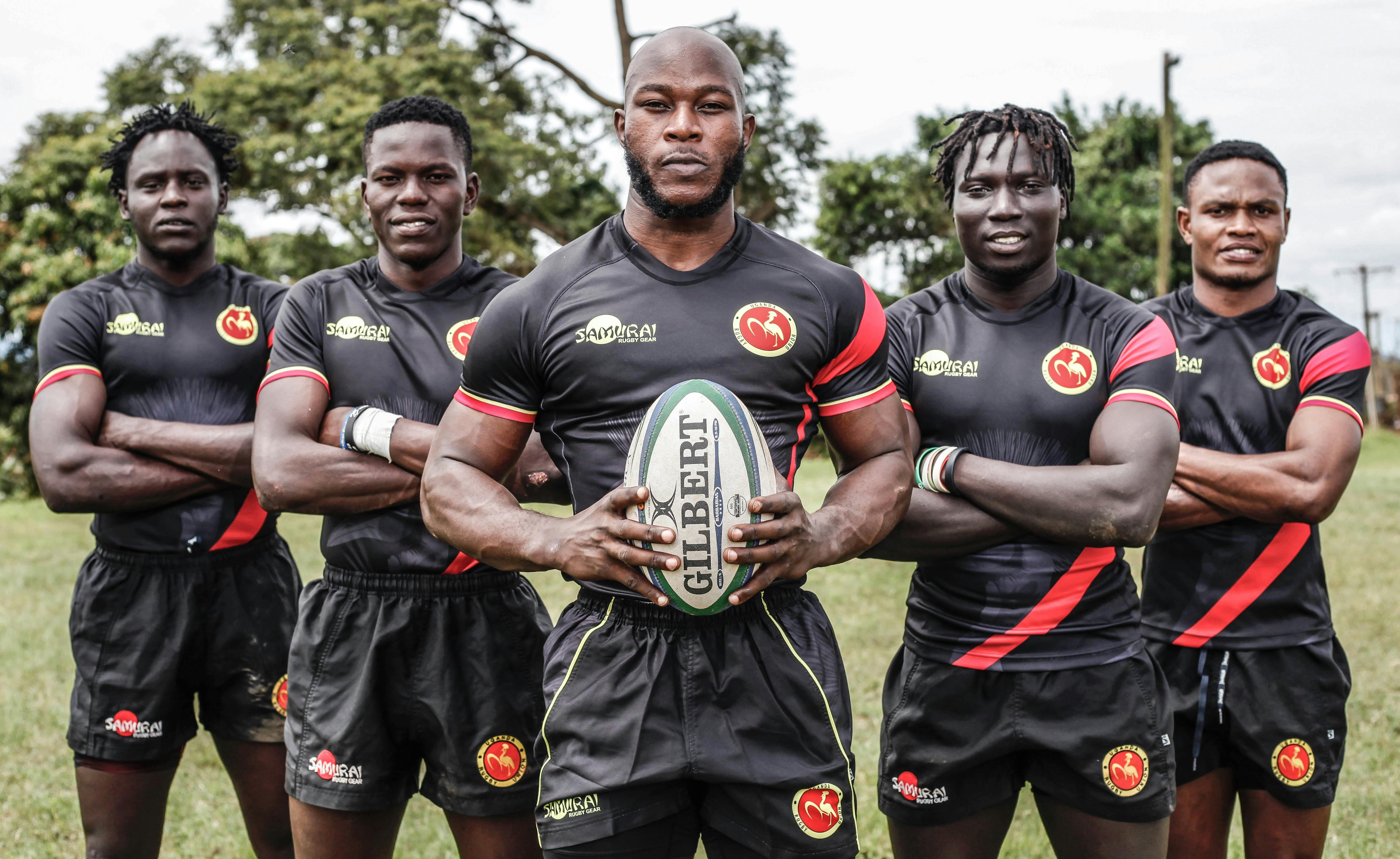 Rugby Players in Black Uniform Standing on Green Field while Smiling at ...