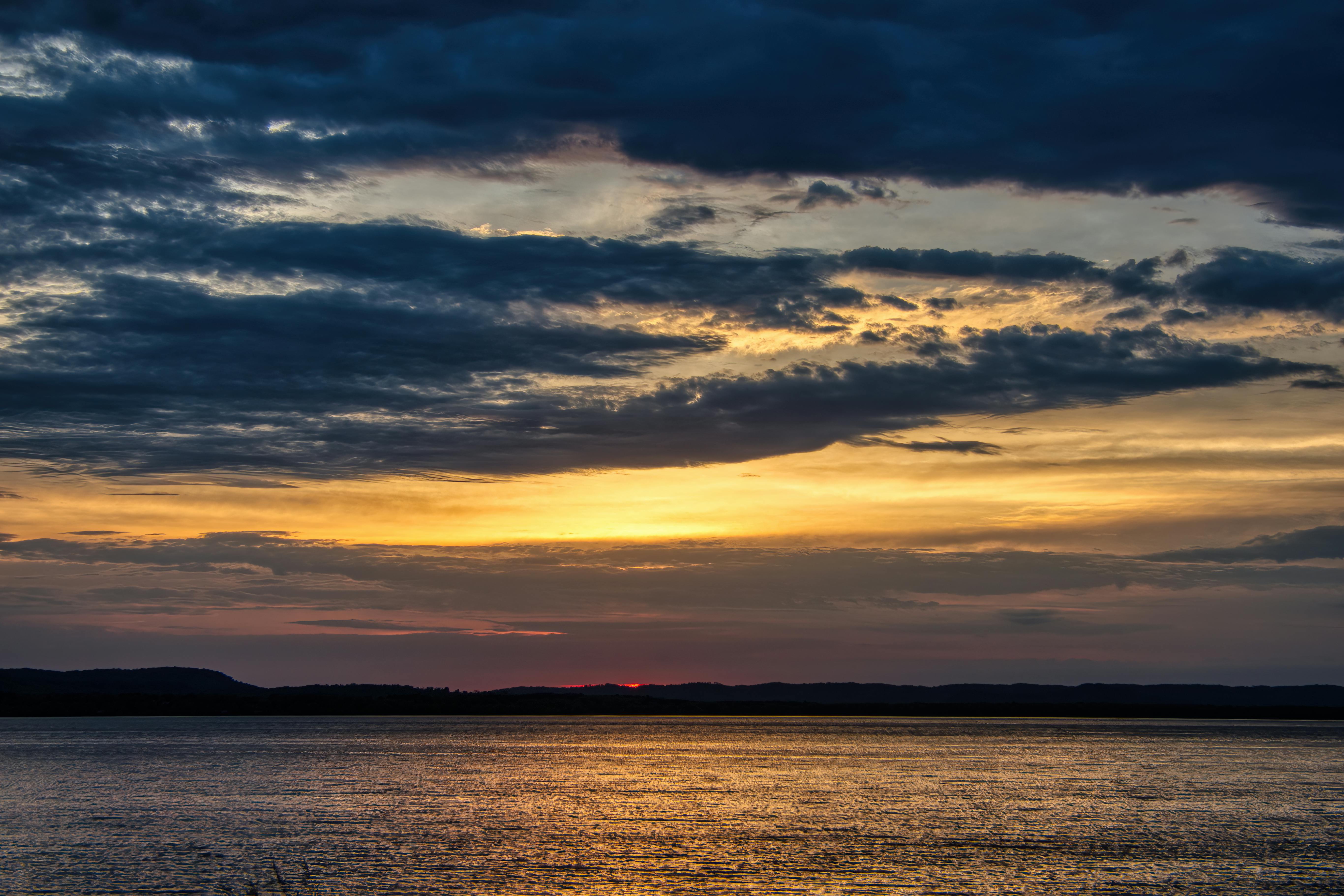 A Hand on the Water During Sunset · Free Stock Photo