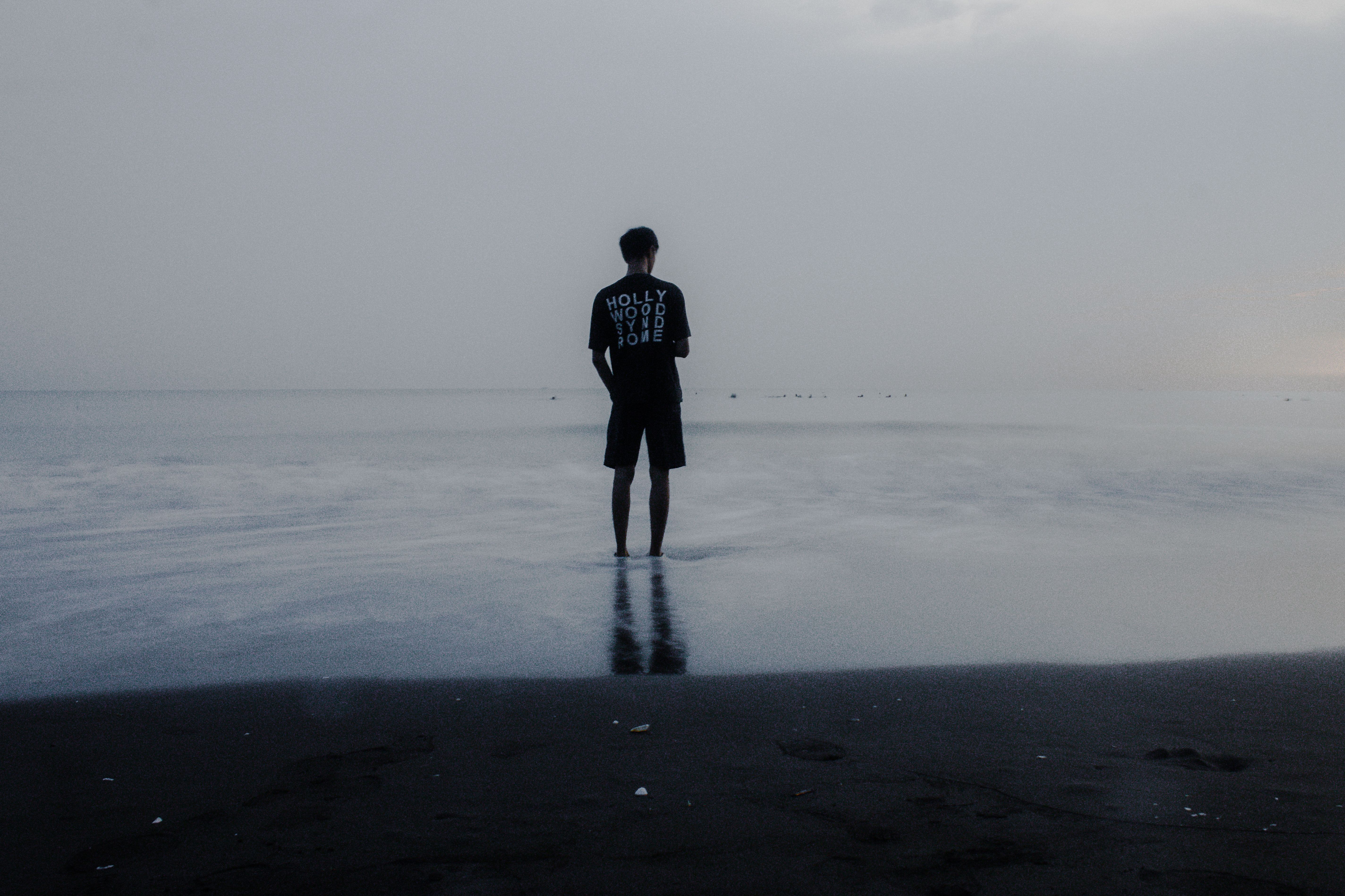 Men Posing on Beach · Free Stock Photo