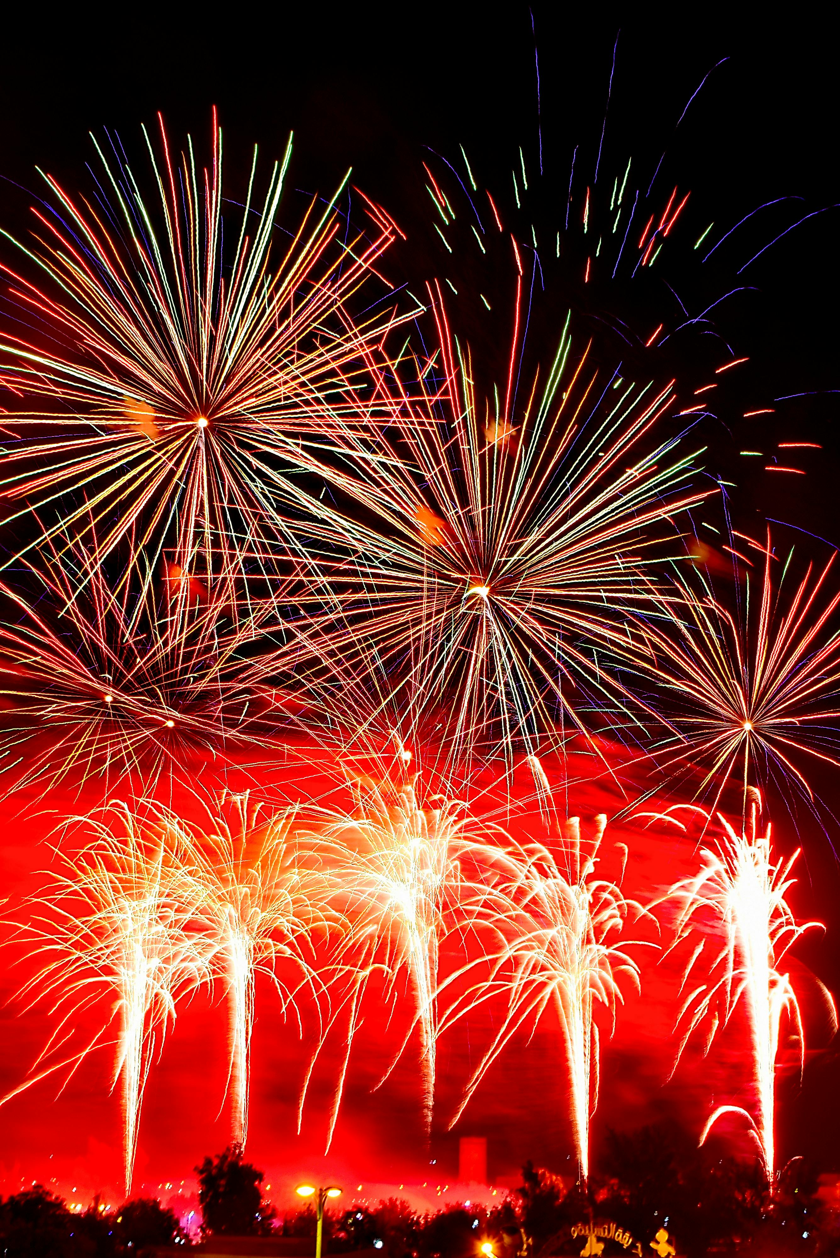 Silhouette Photo of Standing Man Holding Camera Looking at Fireworks ...