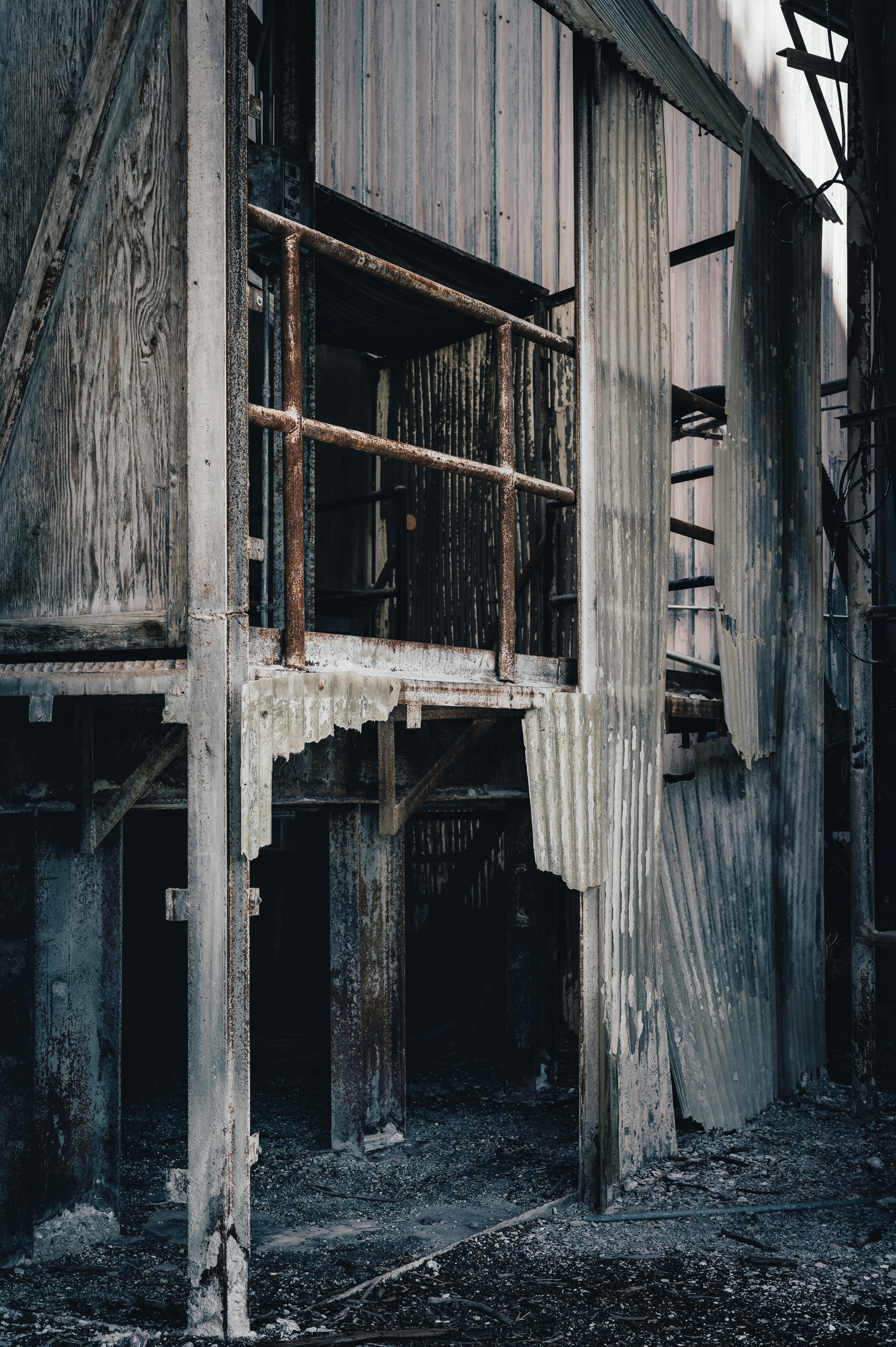 Man Standing Near Ruined Buildings · Free Stock Photo