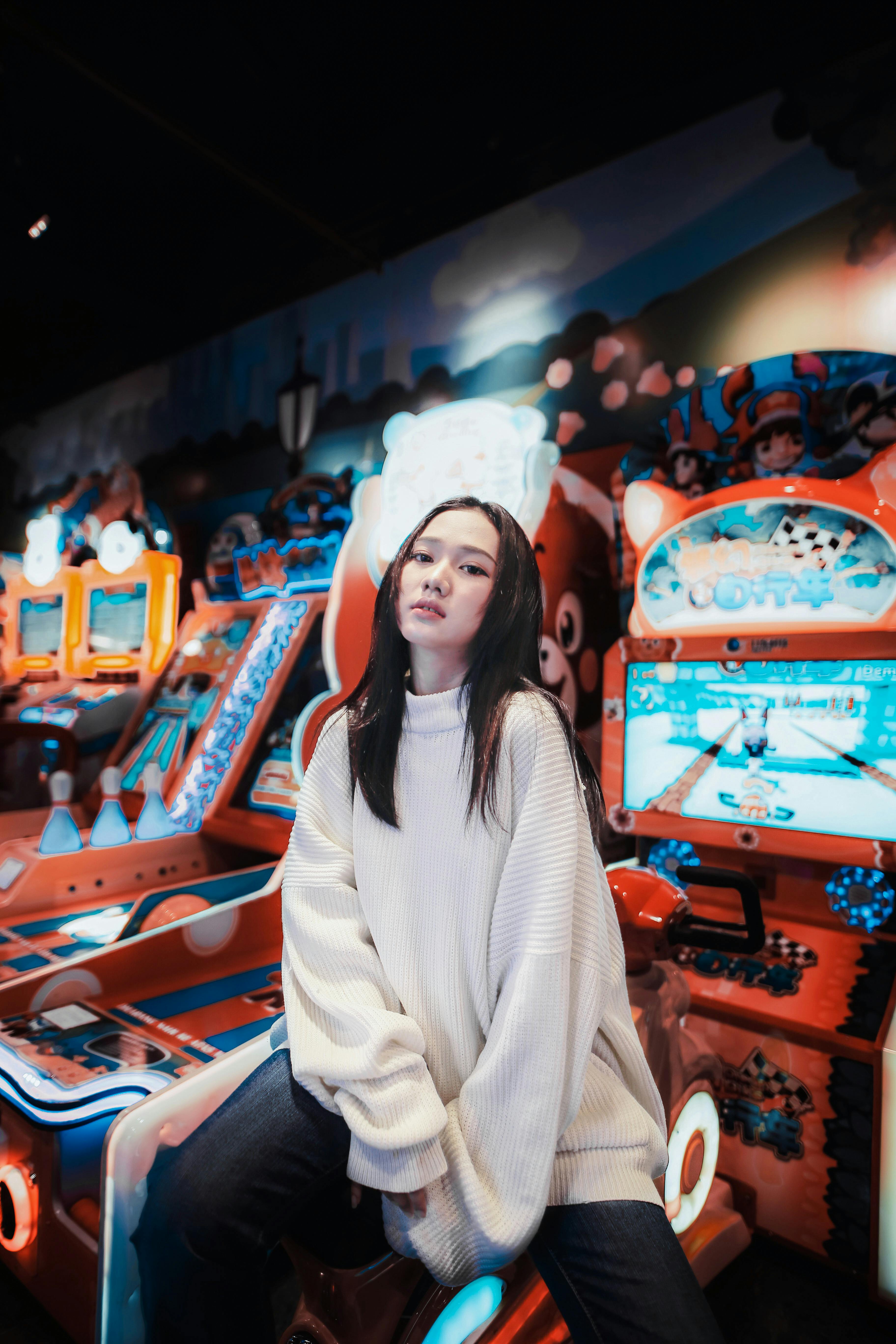 Two People Playing an Arcade Game · Free Stock Photo