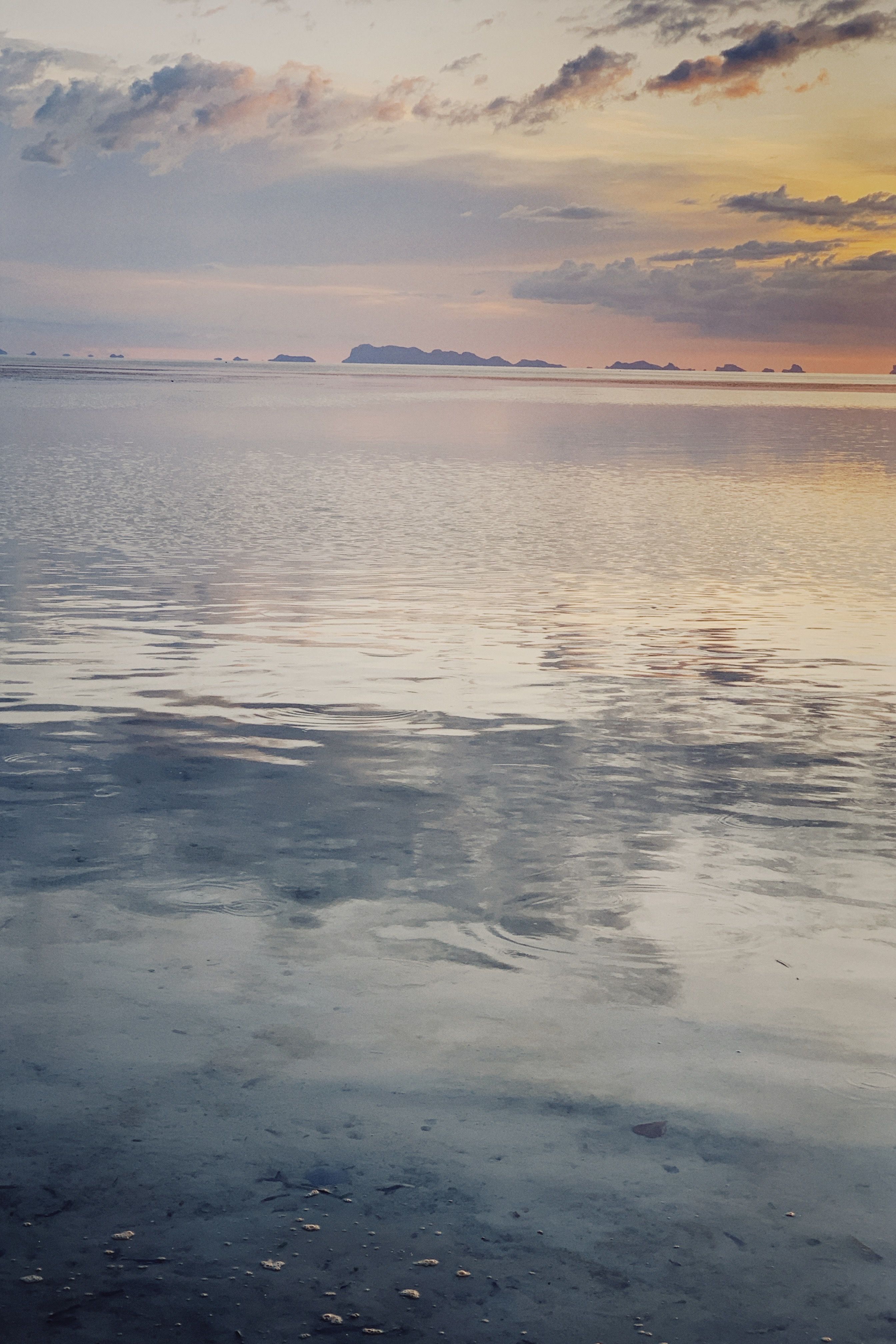 Person Paddling on Sea near City · Free Stock Photo