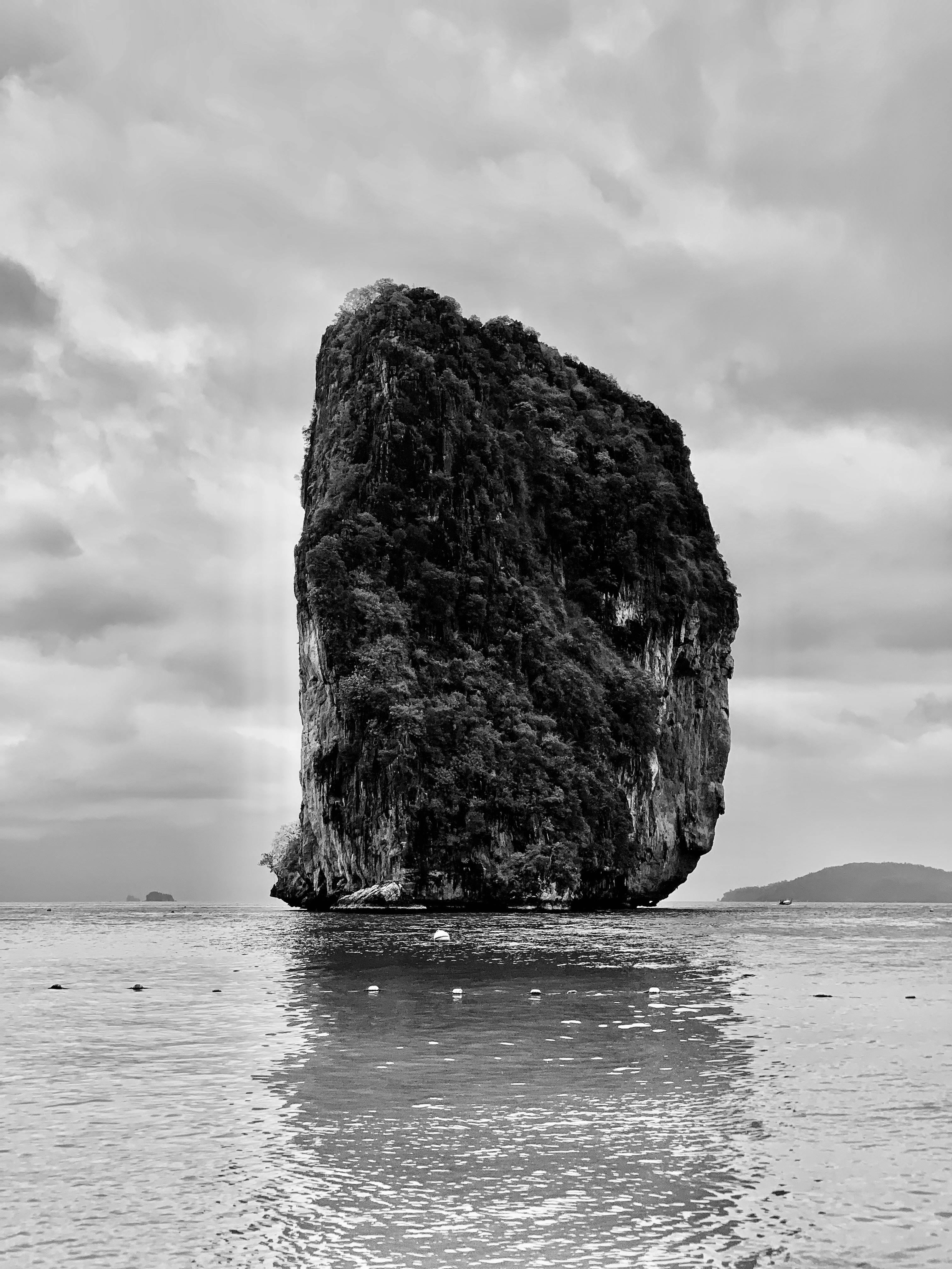 A Massive Rock Formation in a Sea · Free Stock Photo