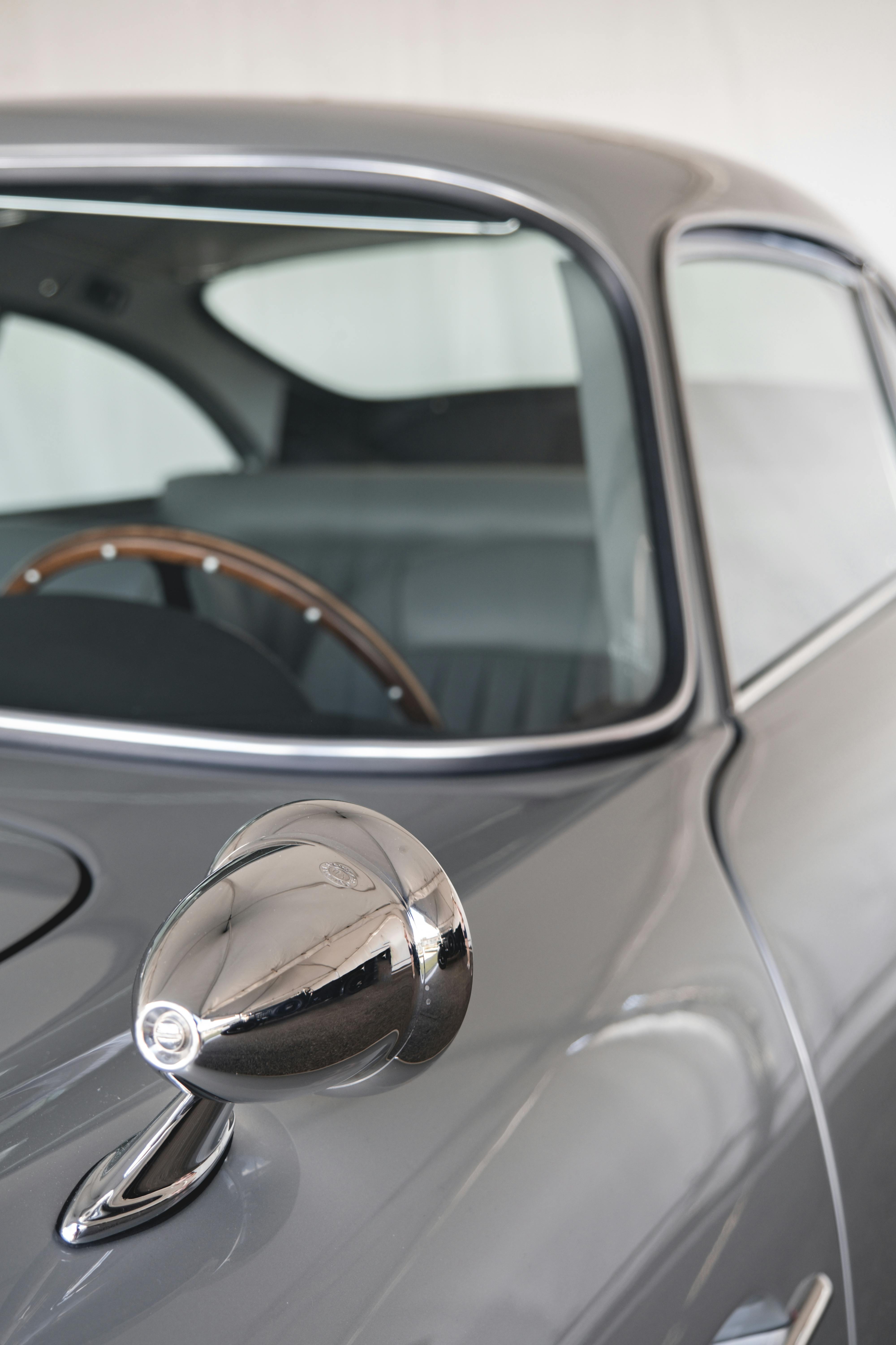 Side-View Mirror of a Clean Gray Vintage Car · Free Stock Photo