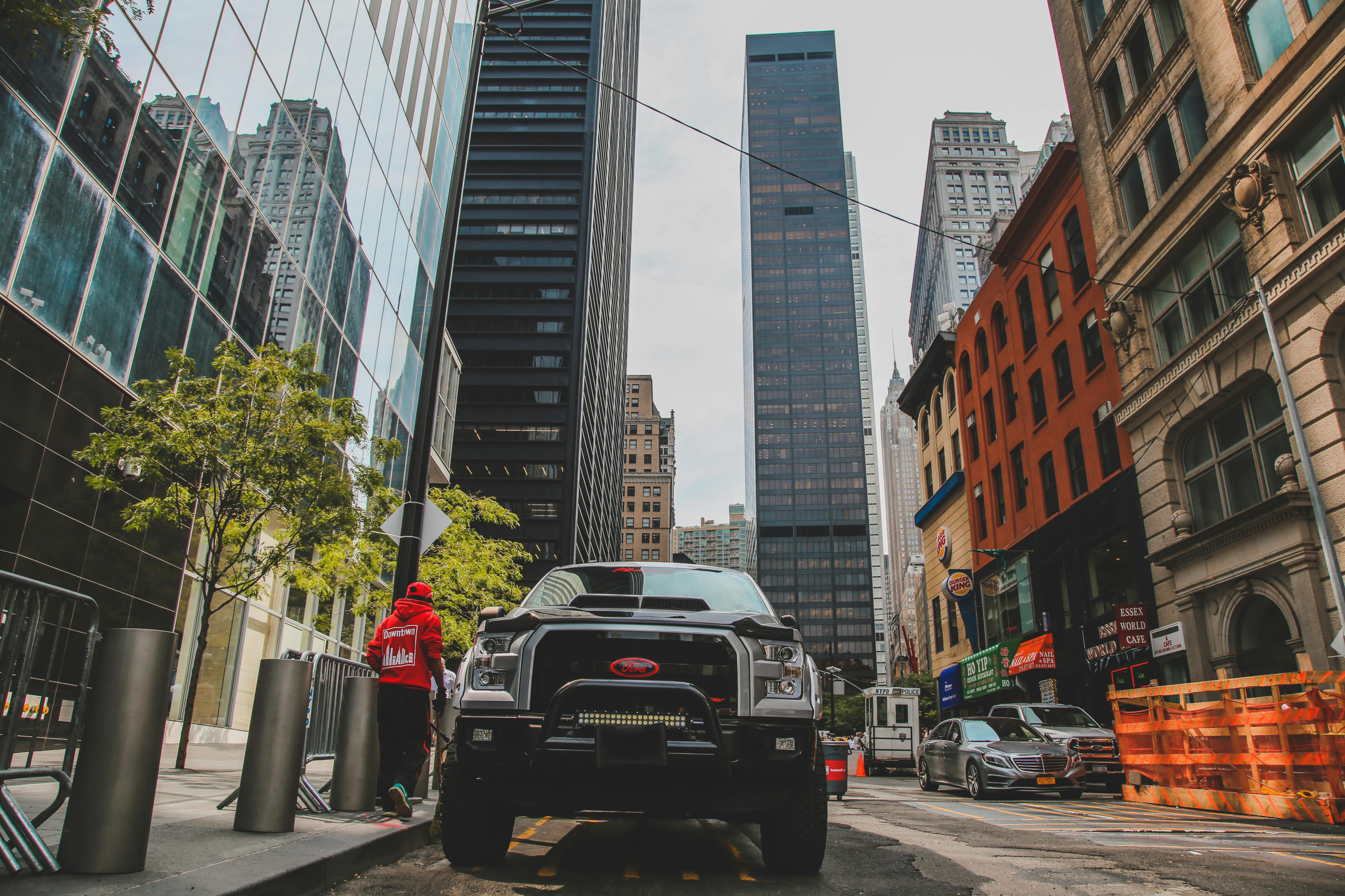 Photography of Roadway in Between Buildings · Free Stock Photo