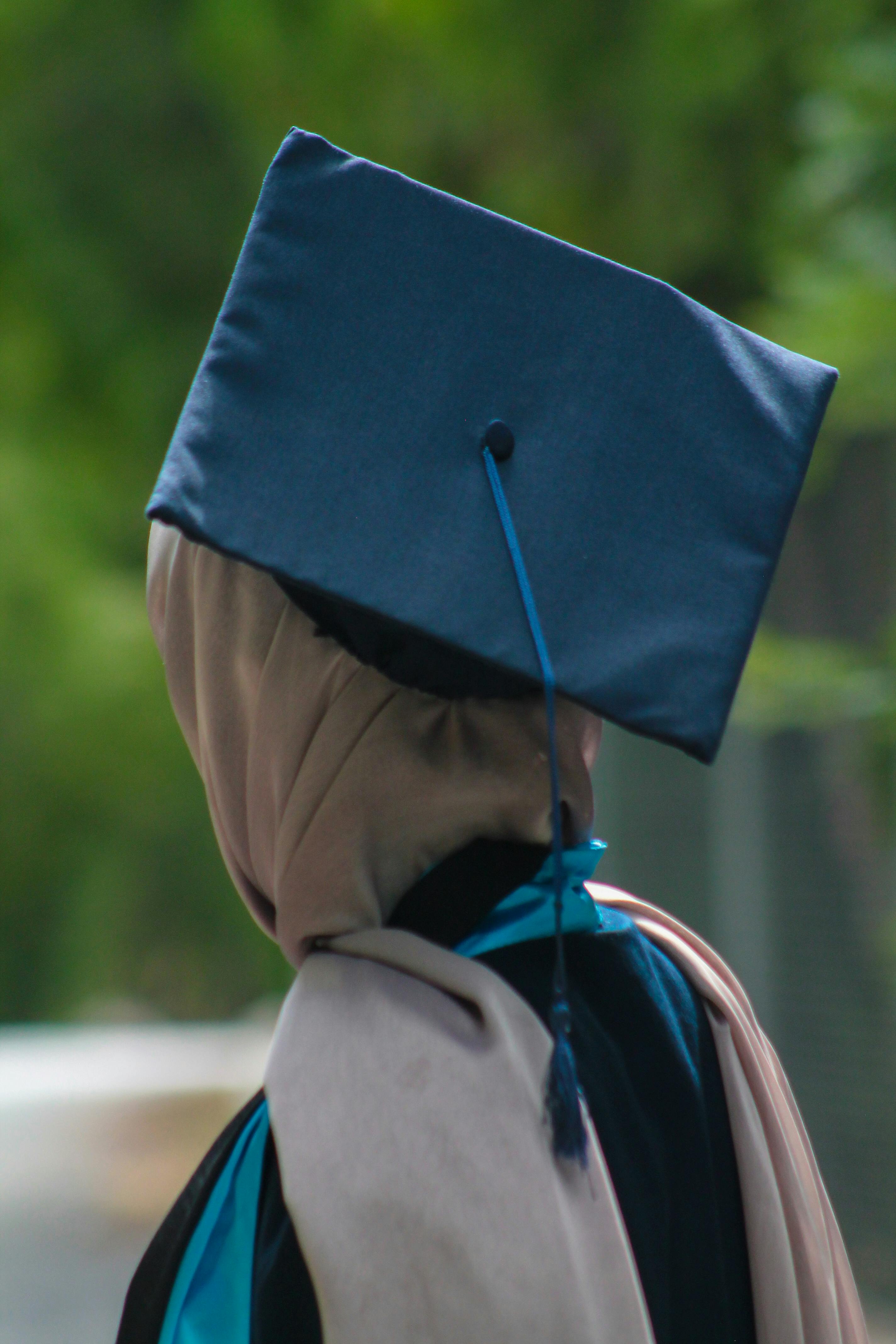 A Person Wearing a Blue Academic Hat · Free Stock Photo