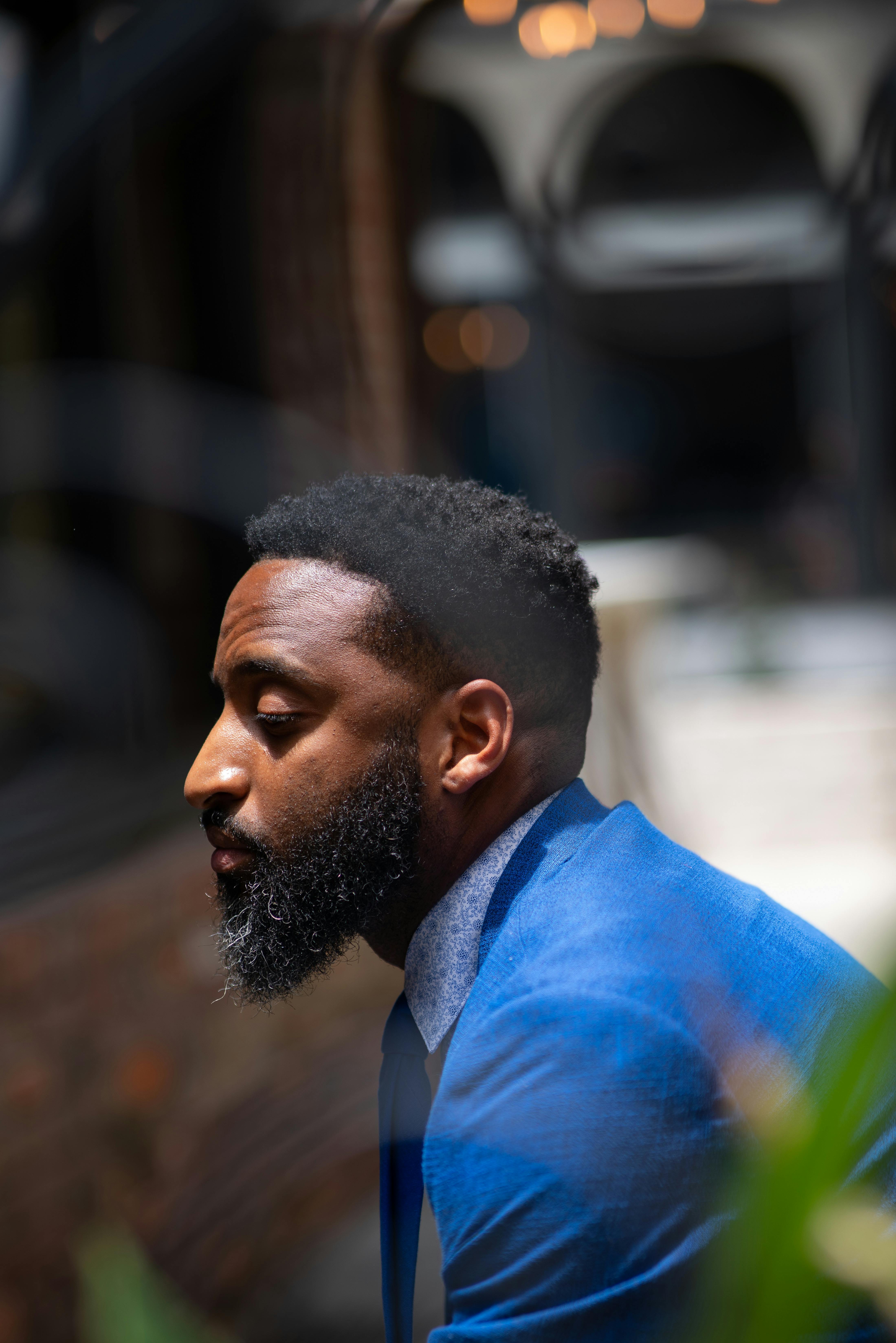 A Bearded Man Wearing a Blue Polo and Necktie · Free Stock Photo