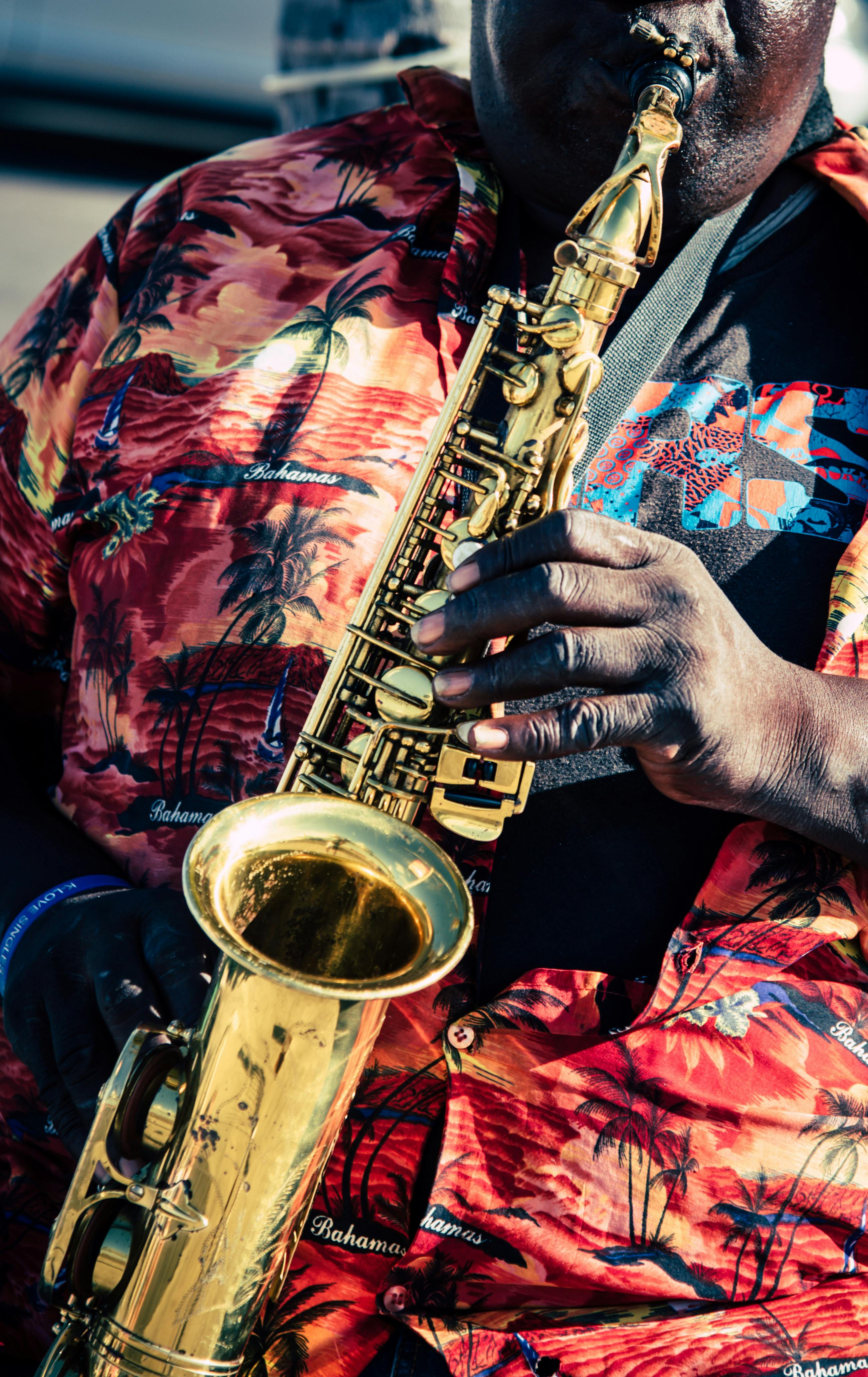Person Holding Brass Saxophone · Free Stock Photo