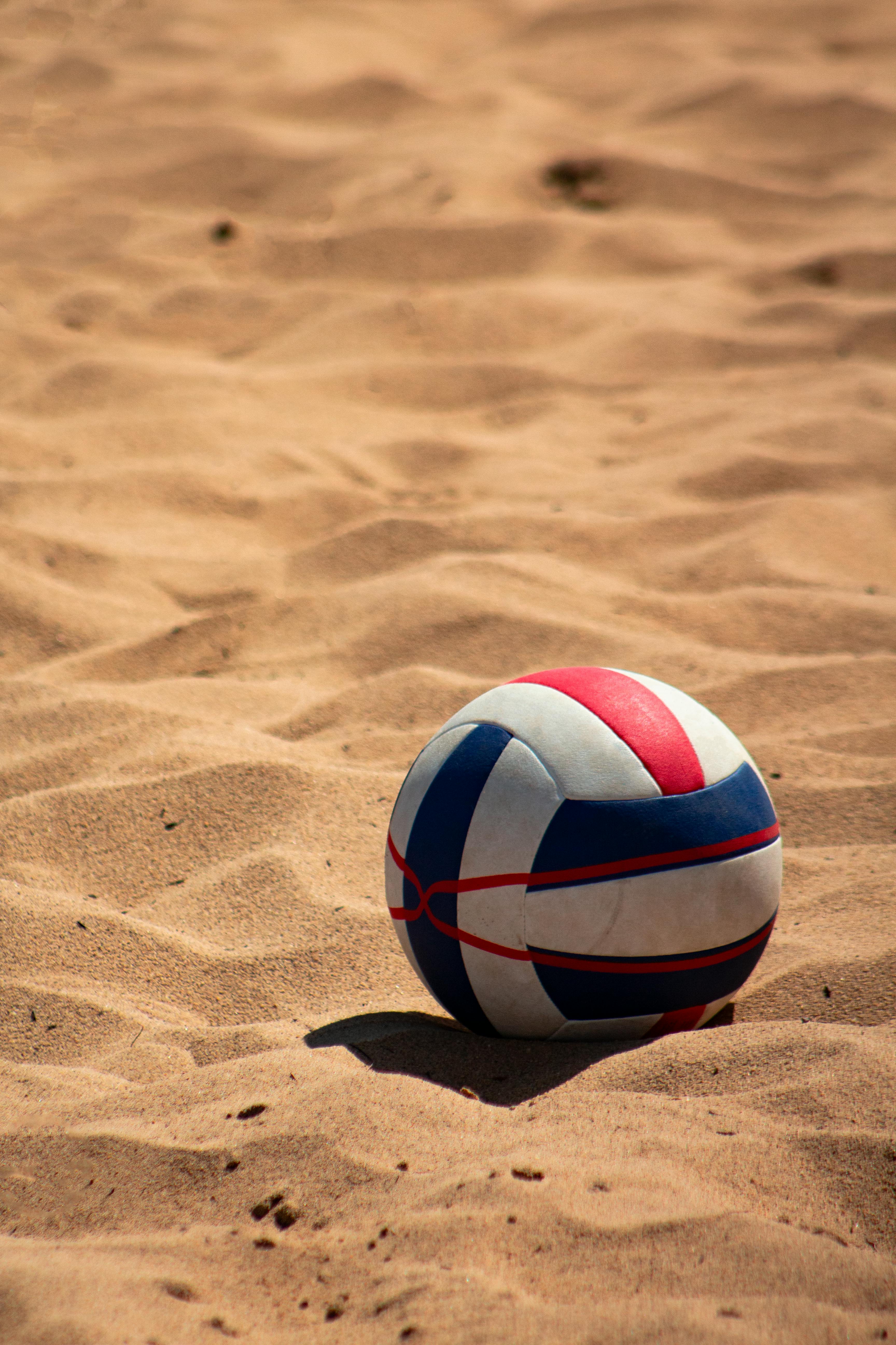 White Red and Blue Volleyball on Sand · Free Stock Photo