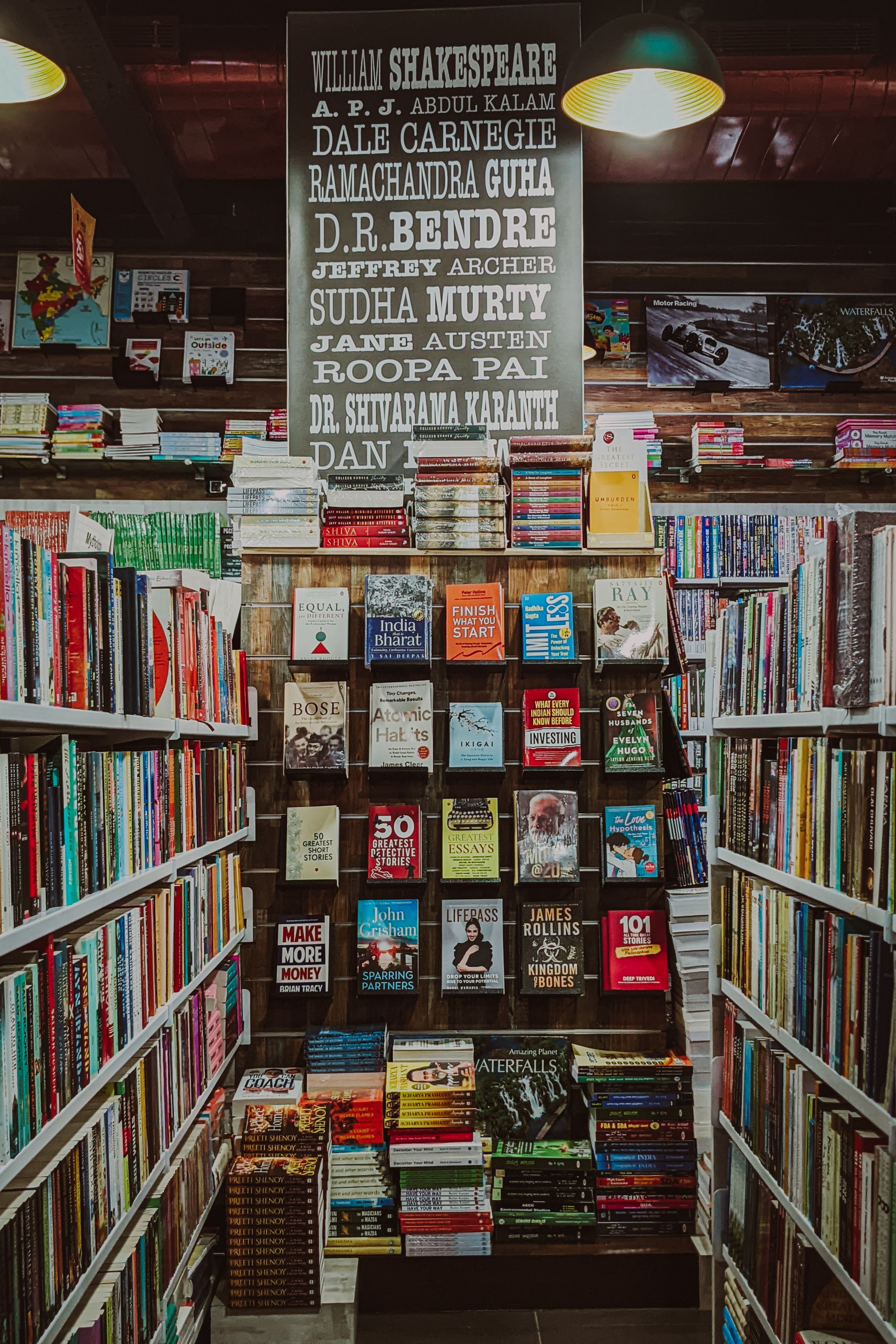 Books on the Shelves of a Library · Free Stock Photo