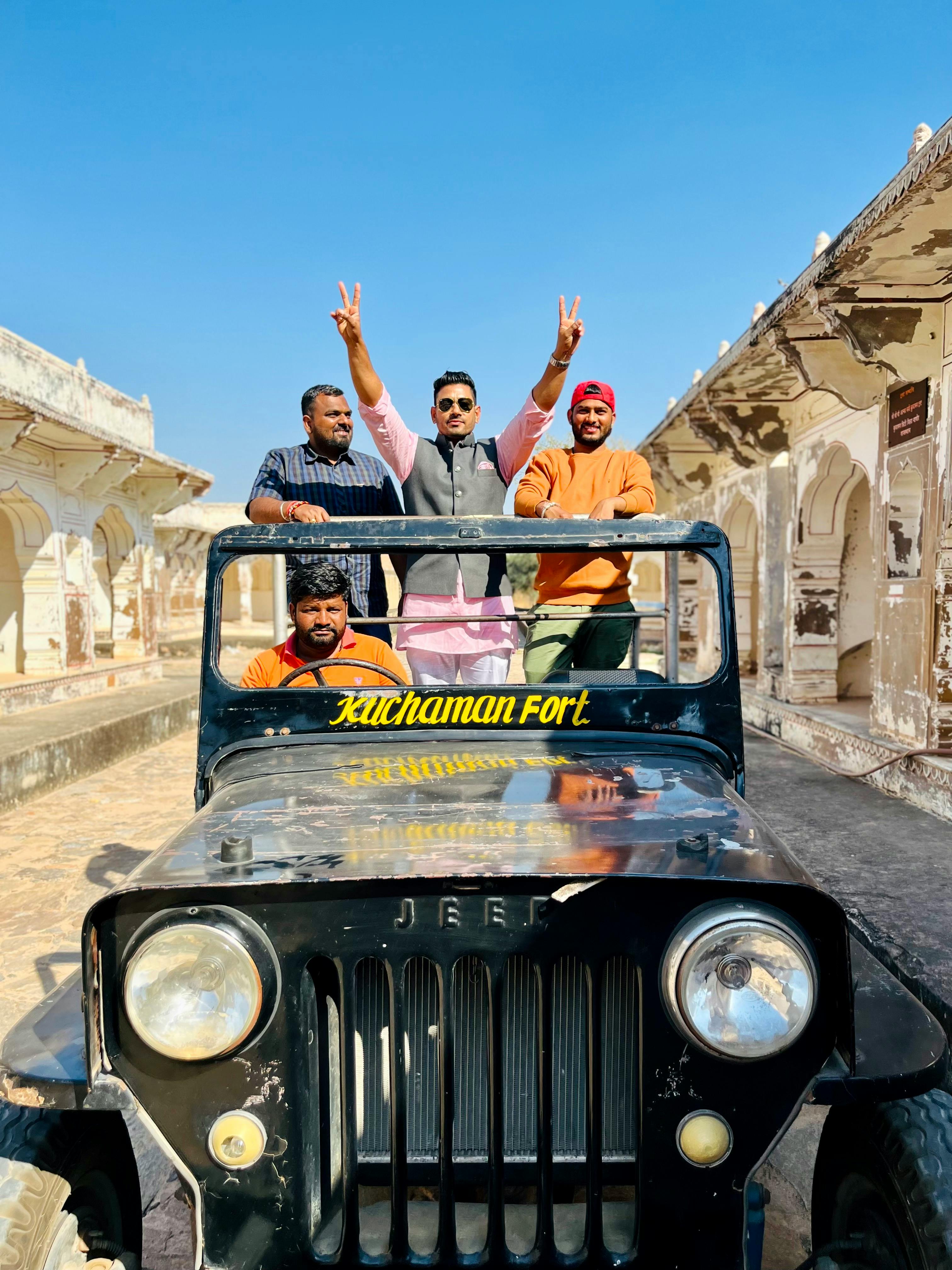 Men Riding on an Off-Road Vehicle · Free Stock Photo