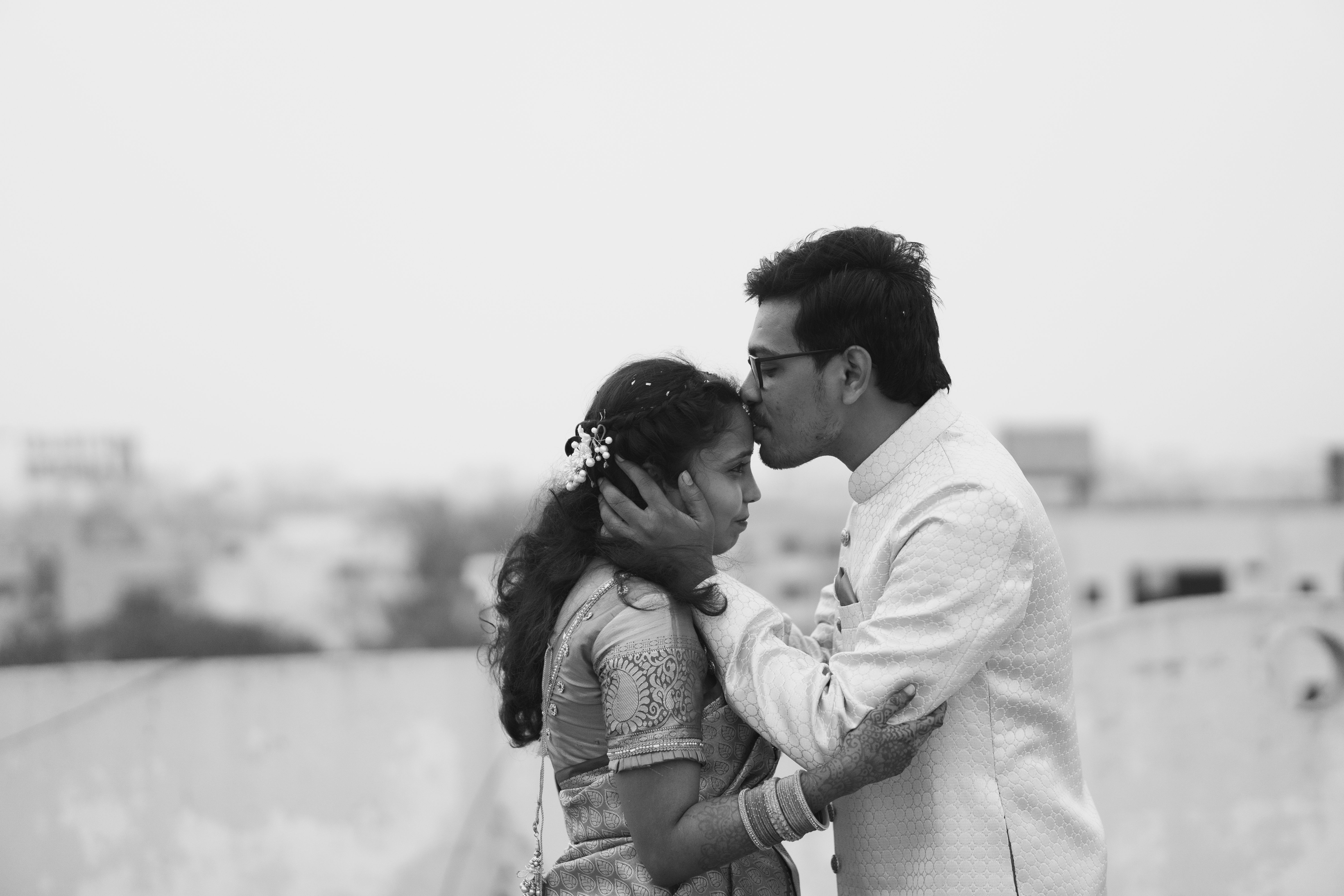Grayscale Photo of Couple Kissing Near the Wooden Carriage · Free Stock ...