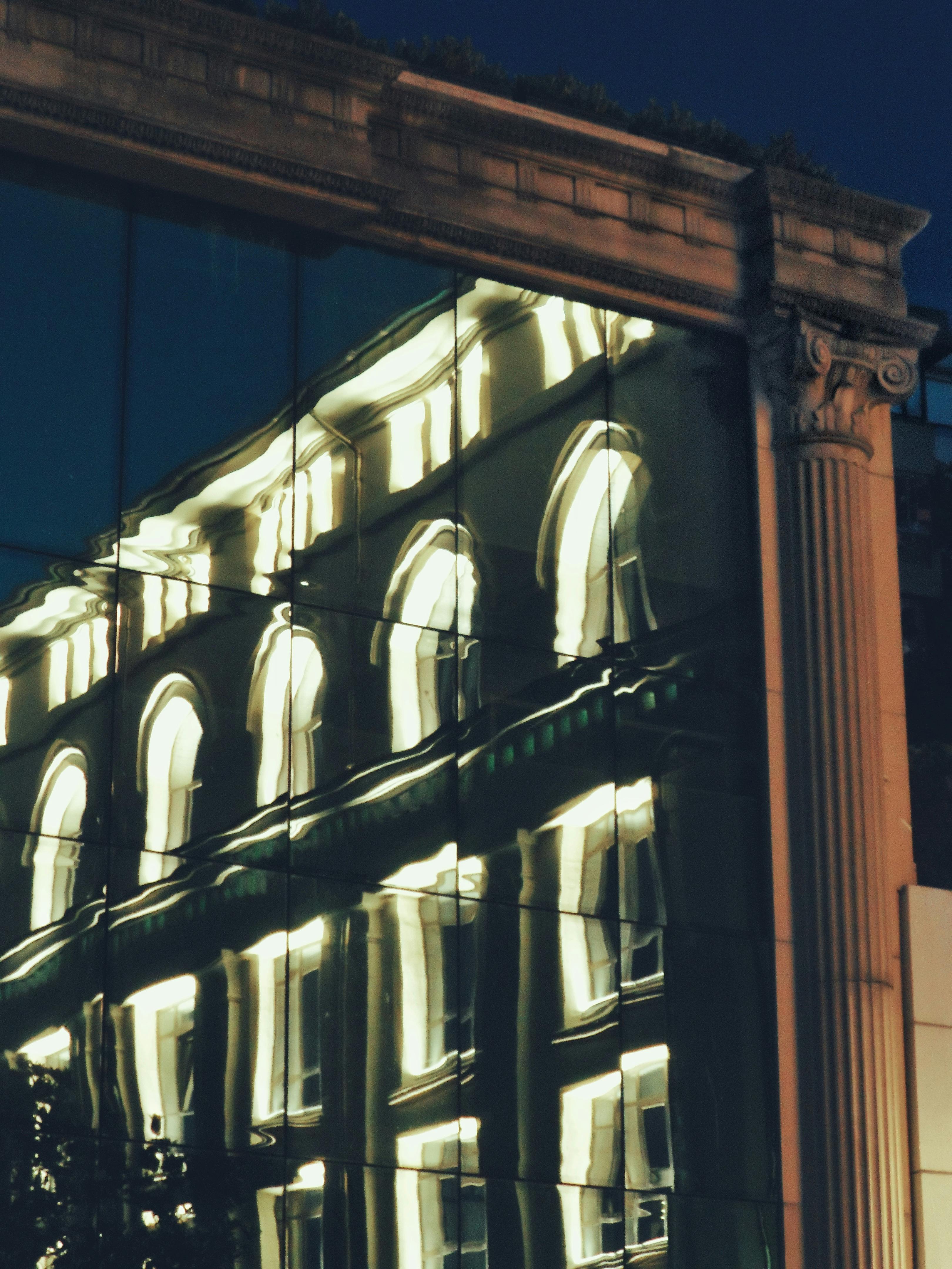 Woman Looking at own Reflection in Glass Pane · Free Stock Photo