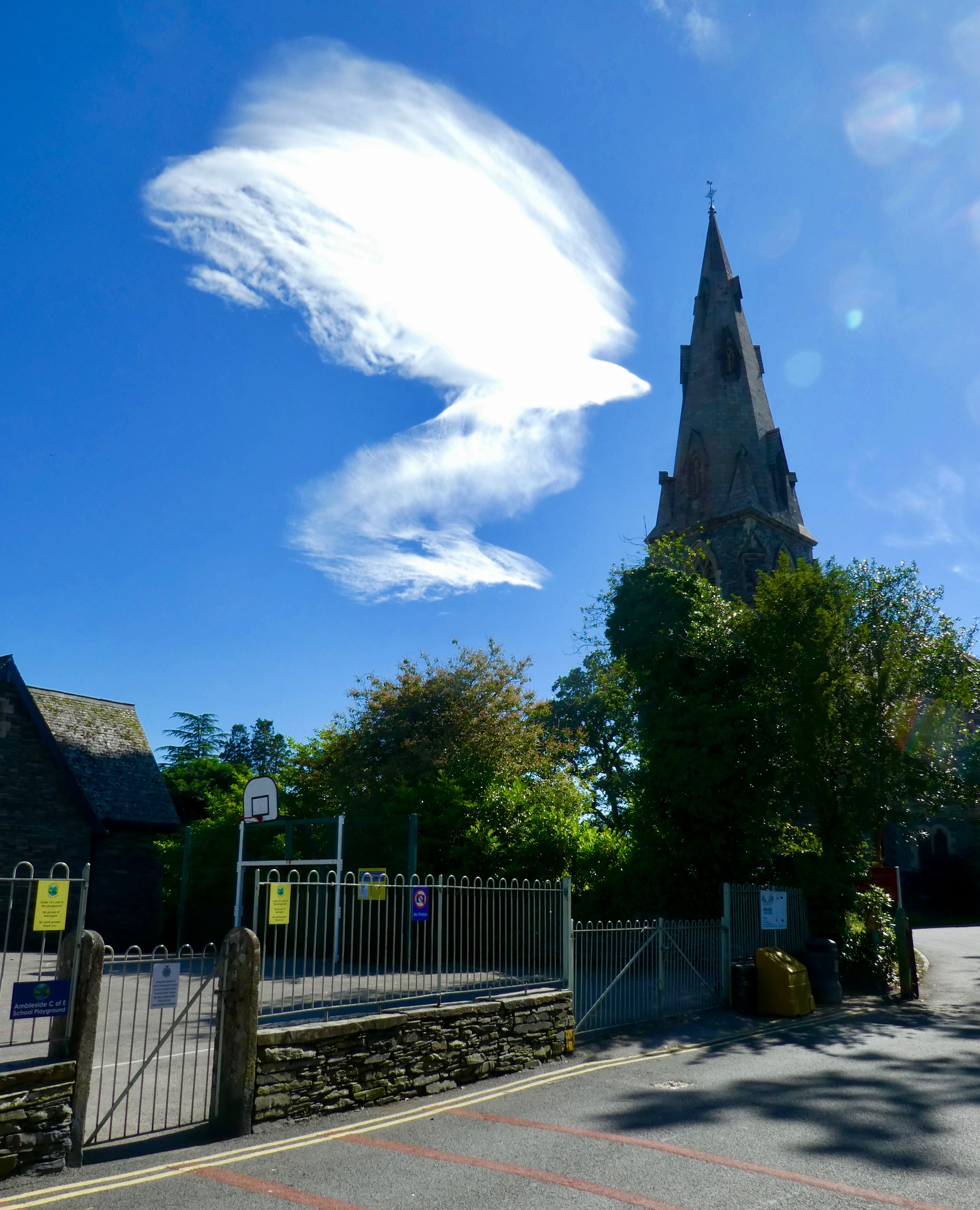 Cloud by a Church Tower · Free Stock Photo