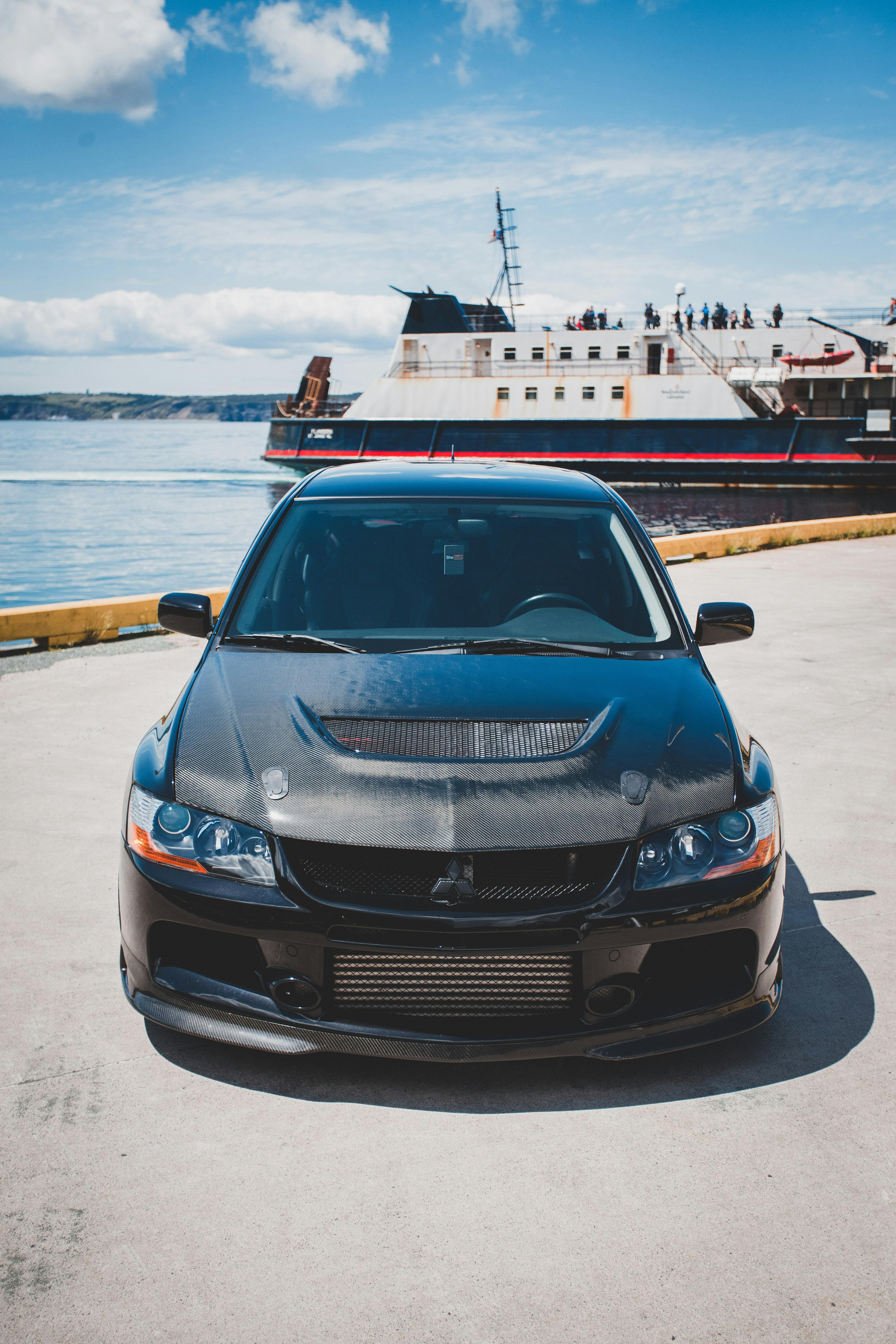 Black Mitsubishi Lancer on a Pier · Free Stock Photo