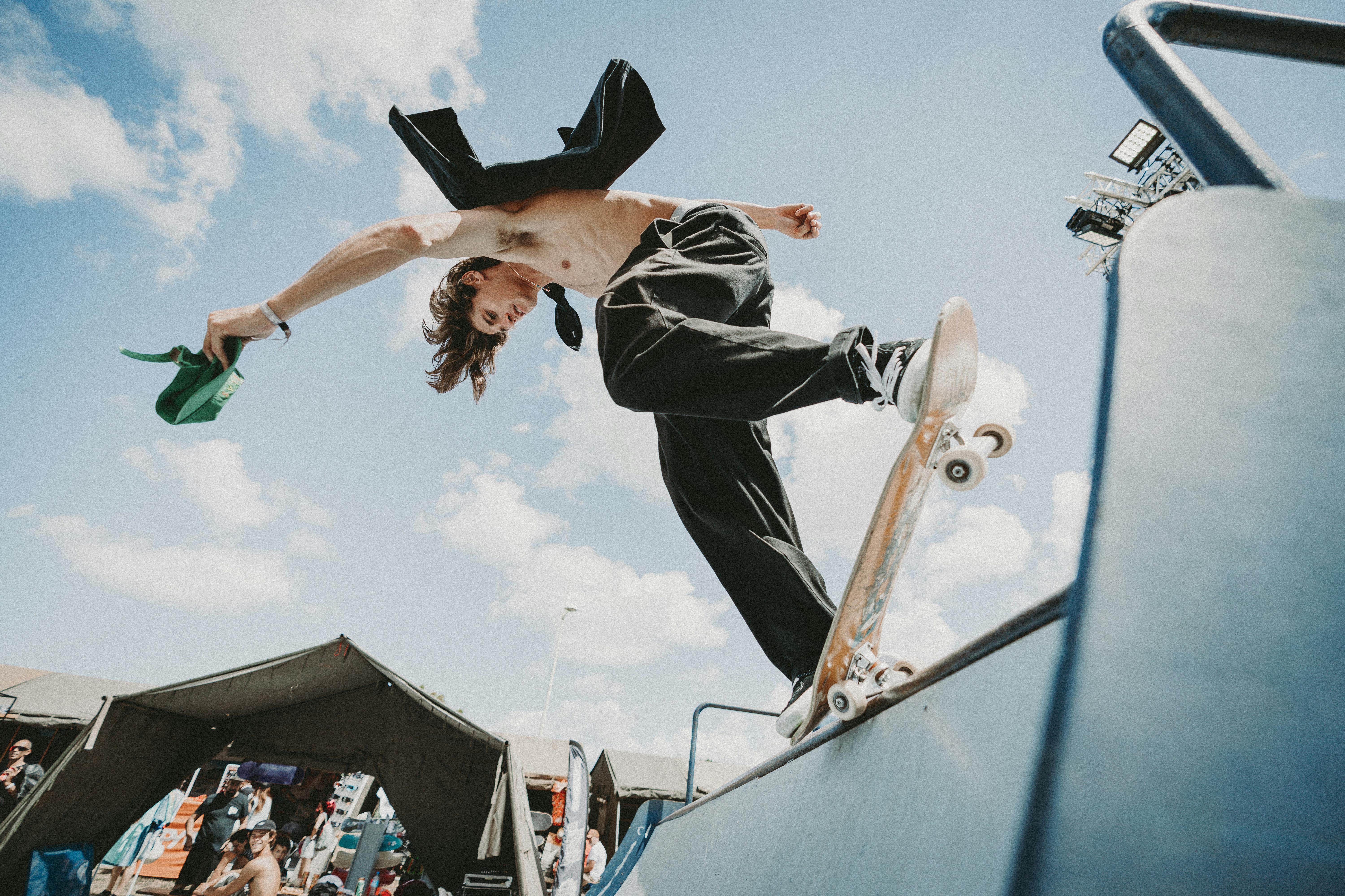 Man in Black T-shirt and Pants Riding a Skateboard · Free Stock Photo