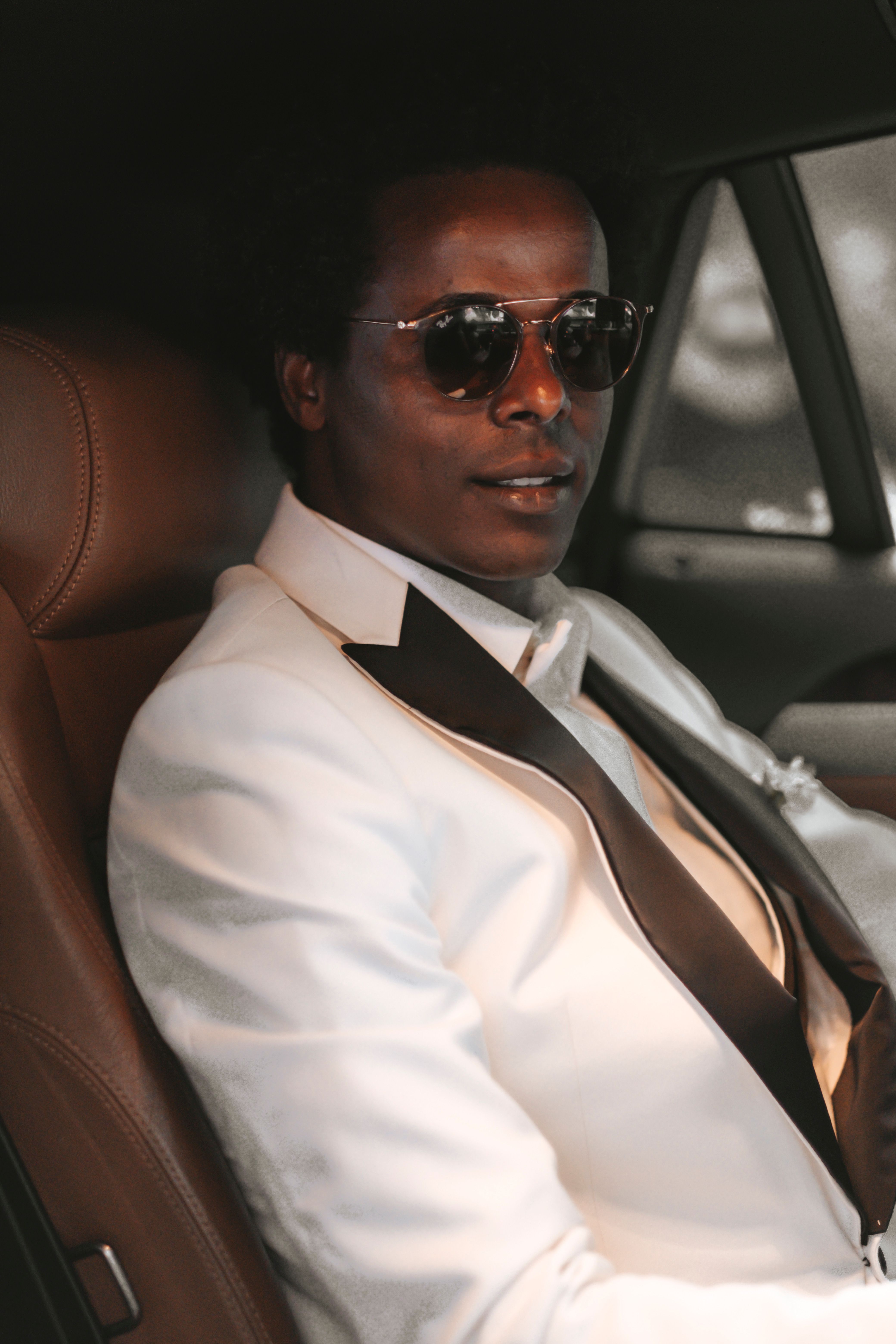 Man in Black Suit Jacket Pointing Up · Free Stock Photo