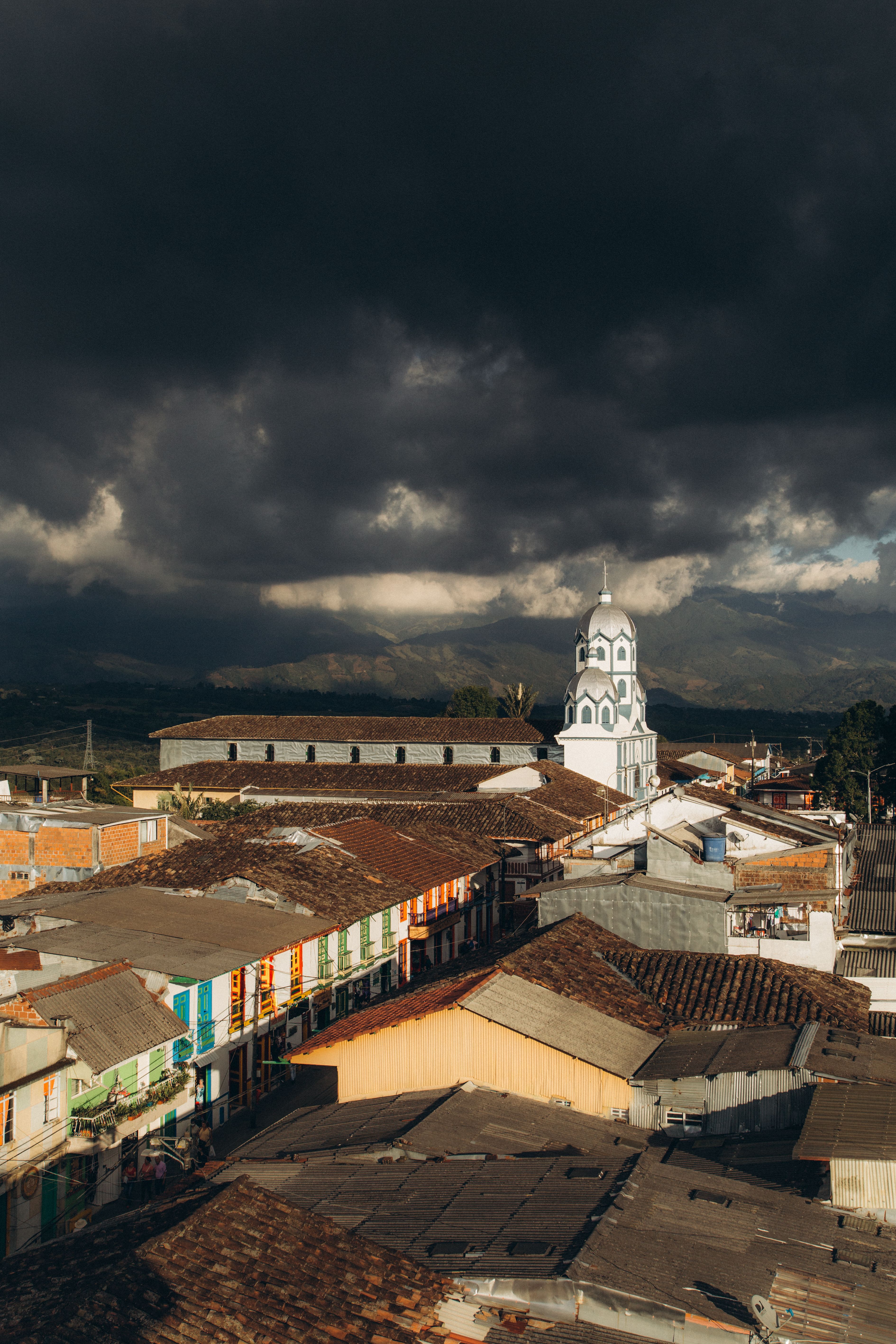 Overcast over Church and Buildings in Town · Free Stock Photo