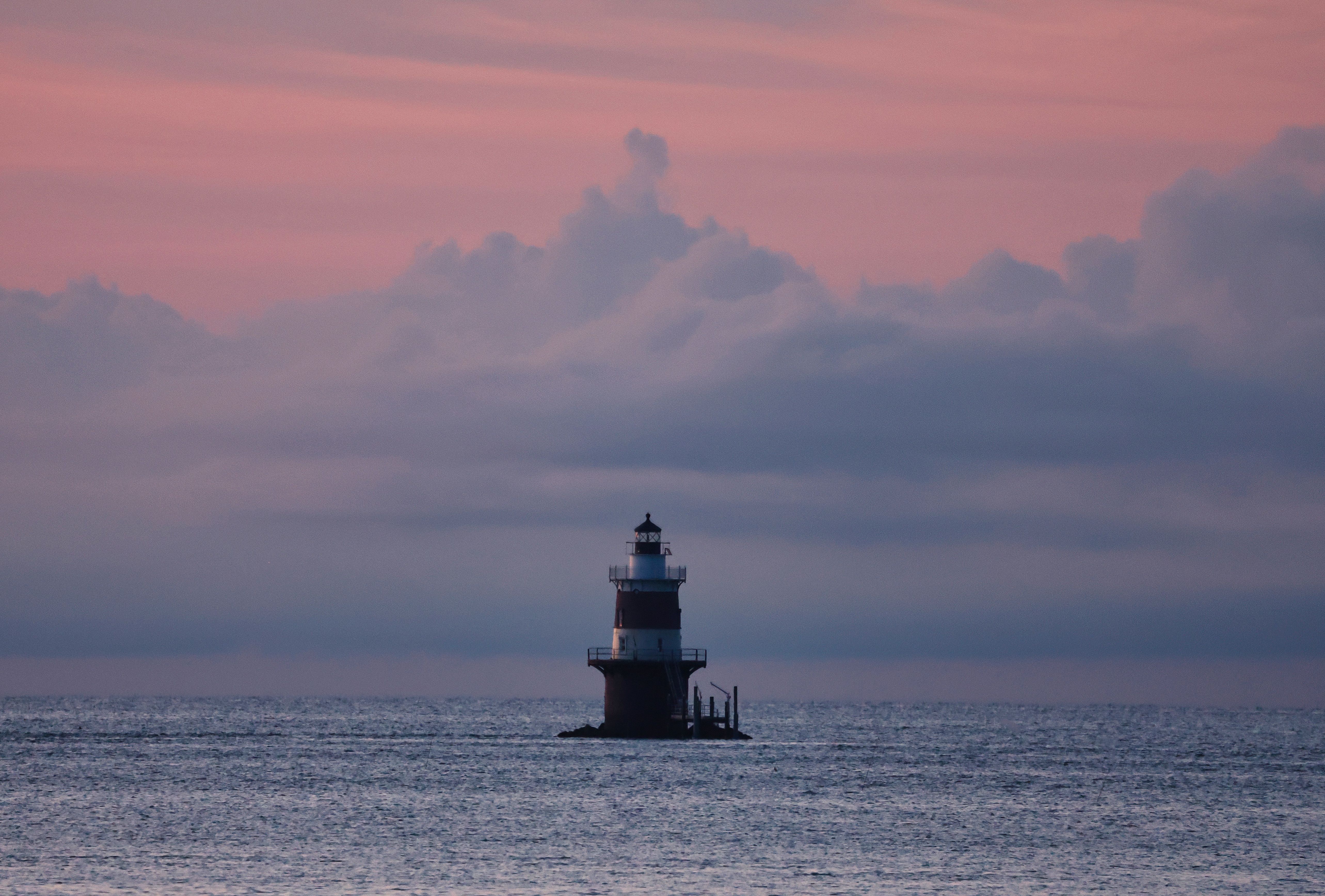 Lighthouse on the Ocean during Dawn · Free Stock Photo