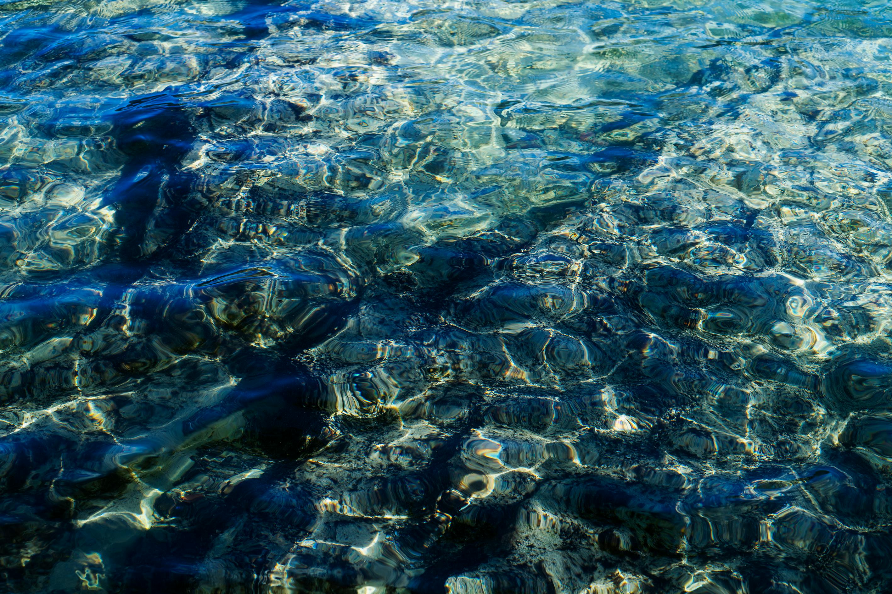 A Close-Up Shot of the Surface of Ocean Water · Free Stock Photo
