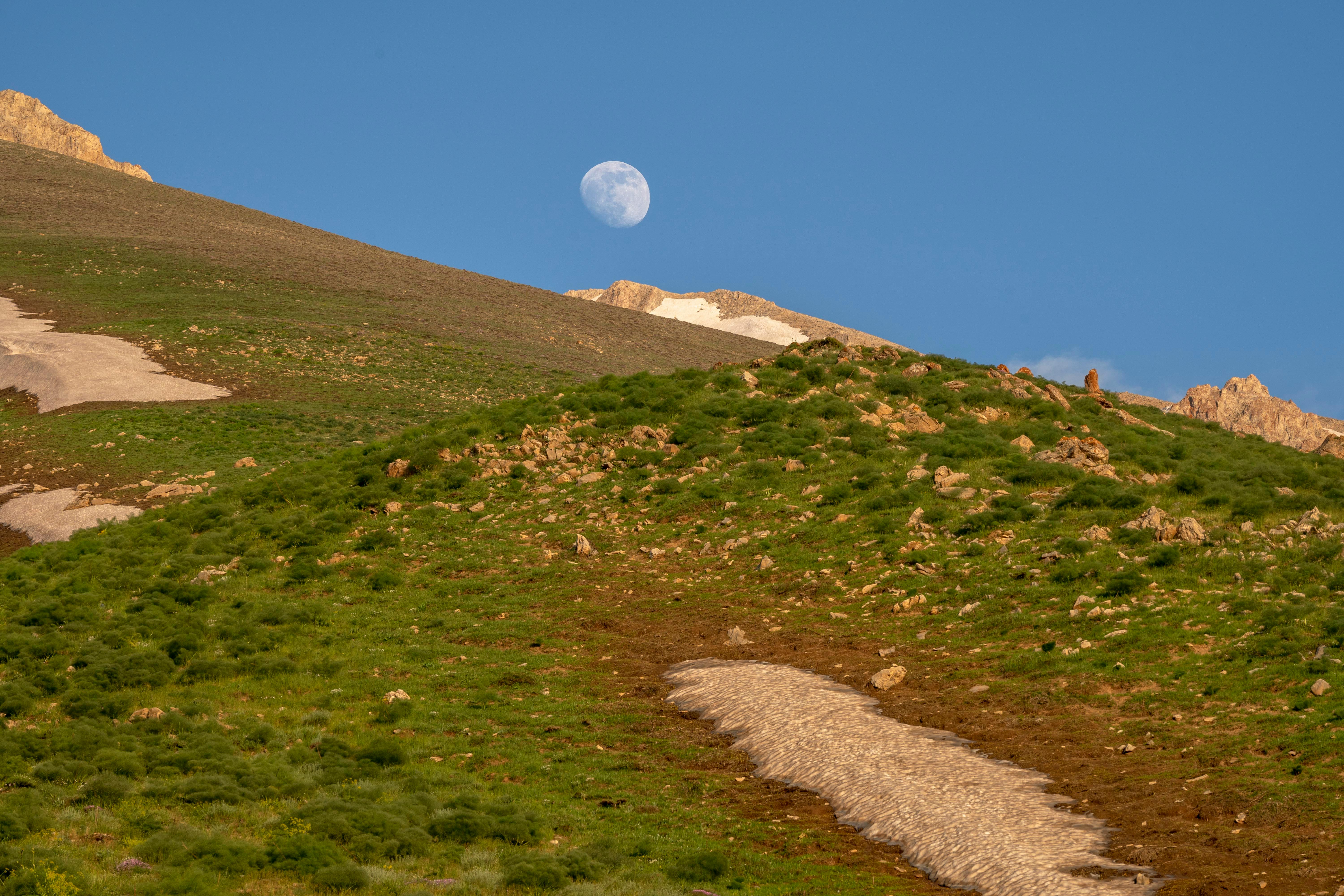 Full Moon Over Mountain Slope Photo · Free Stock Photo