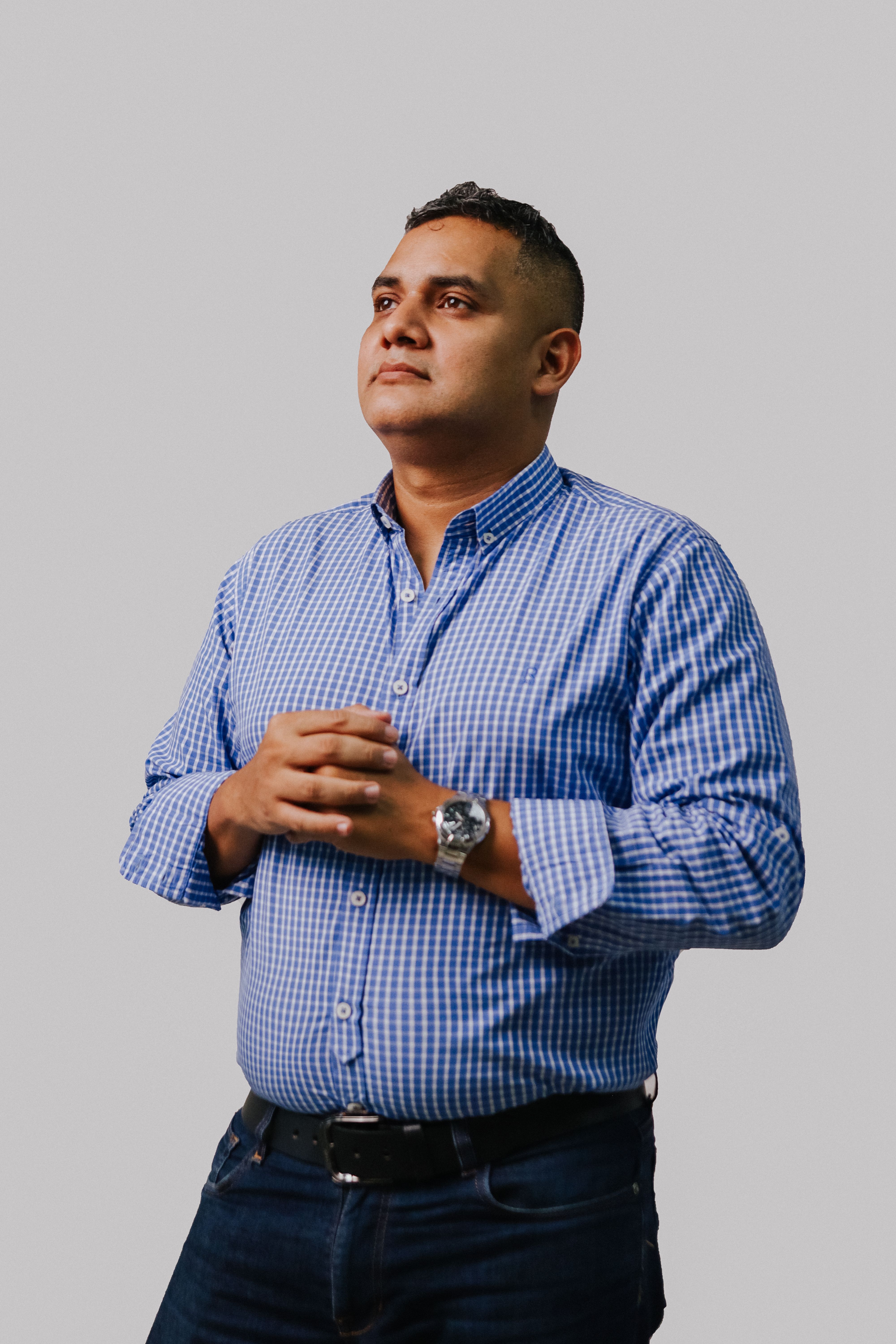 Man Wearing a Button-Down Shirt Posing · Free Stock Photo