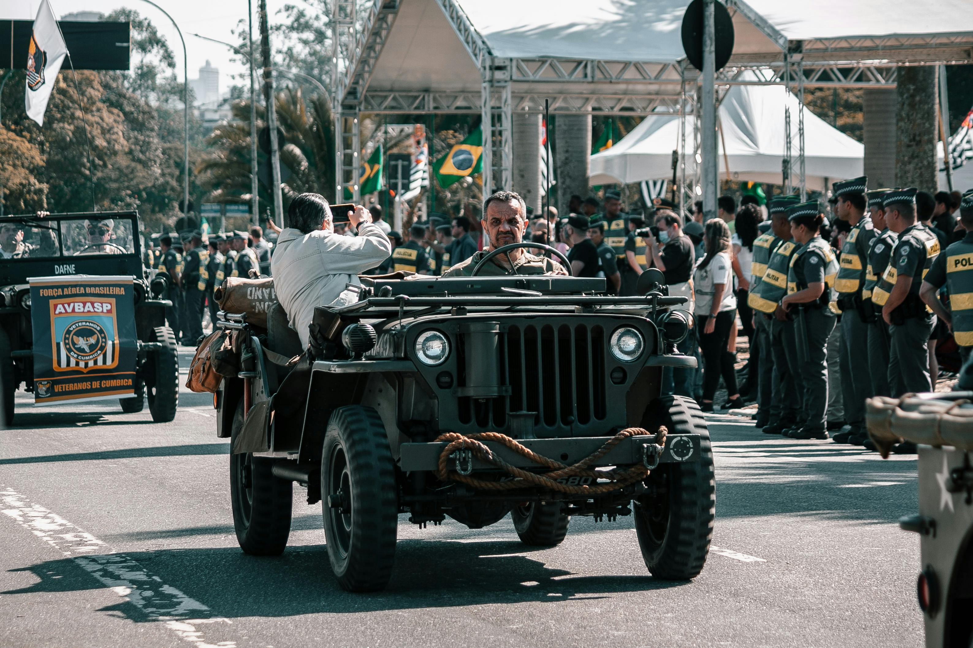 Soldiers in Uniform Riding in Car on City Street · Free Stock Photo
